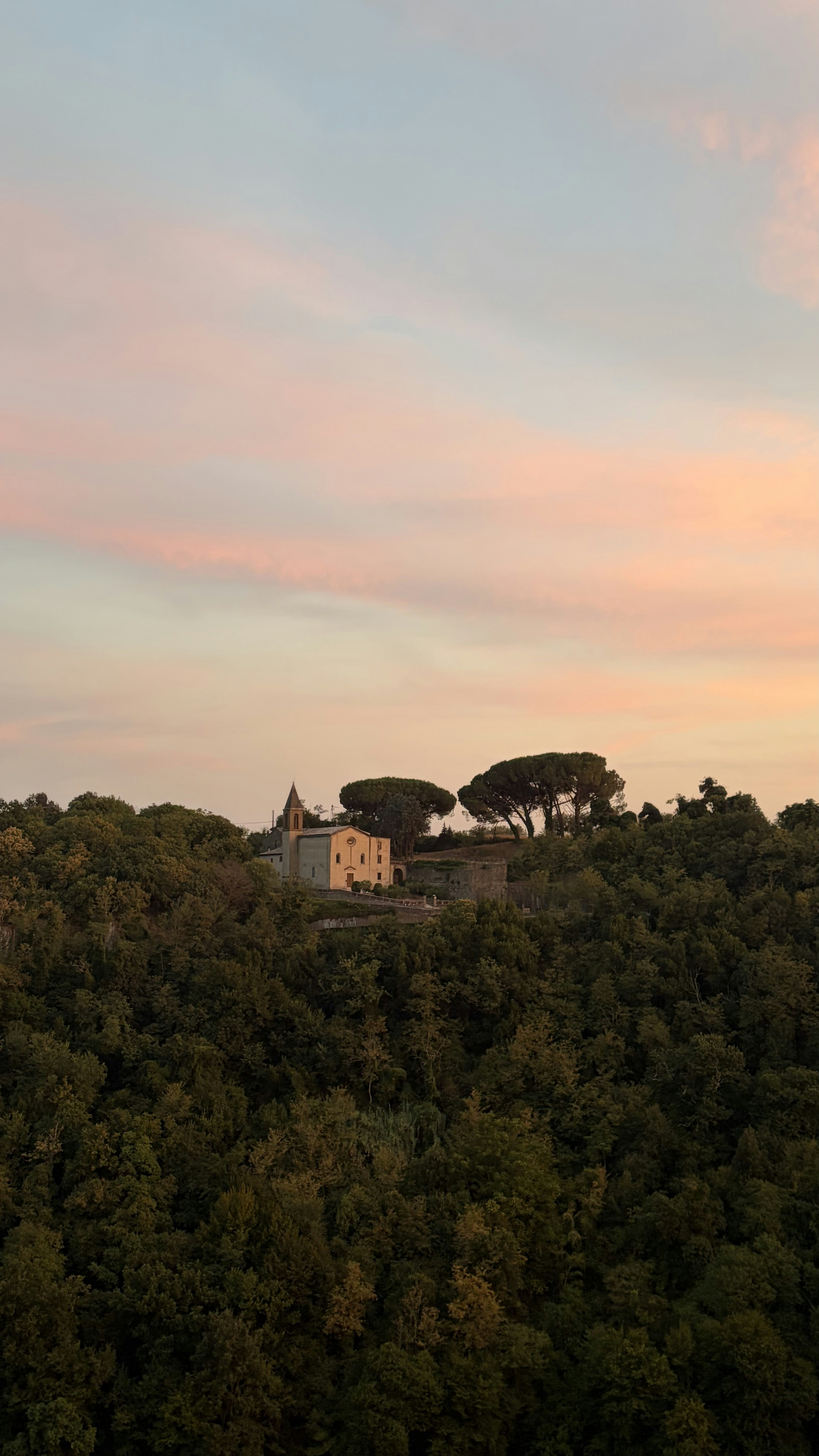 Hilltop Chapel Under a Warm Sunset