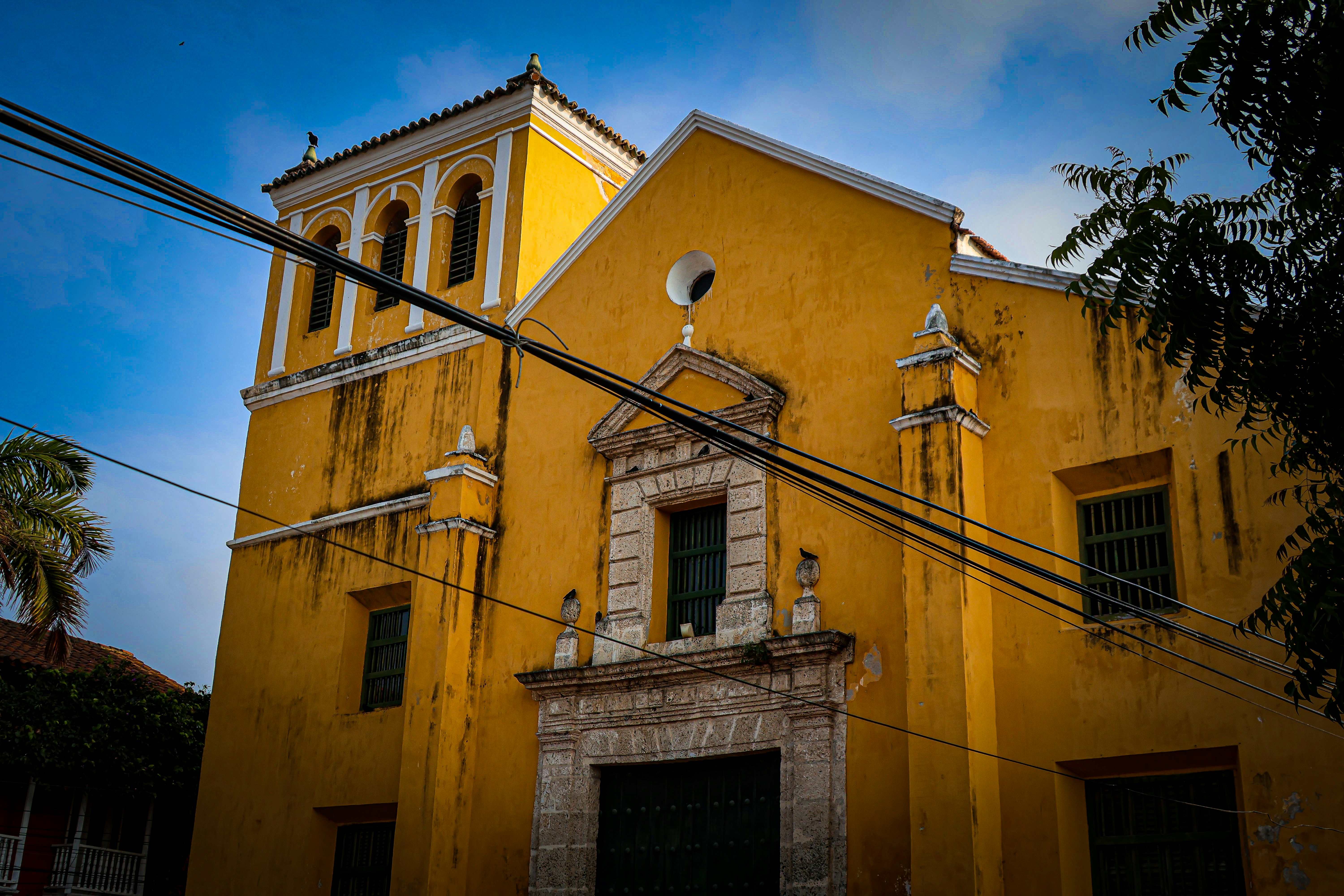 Sunlit Yellow Mission: Architectural Light and Shadow