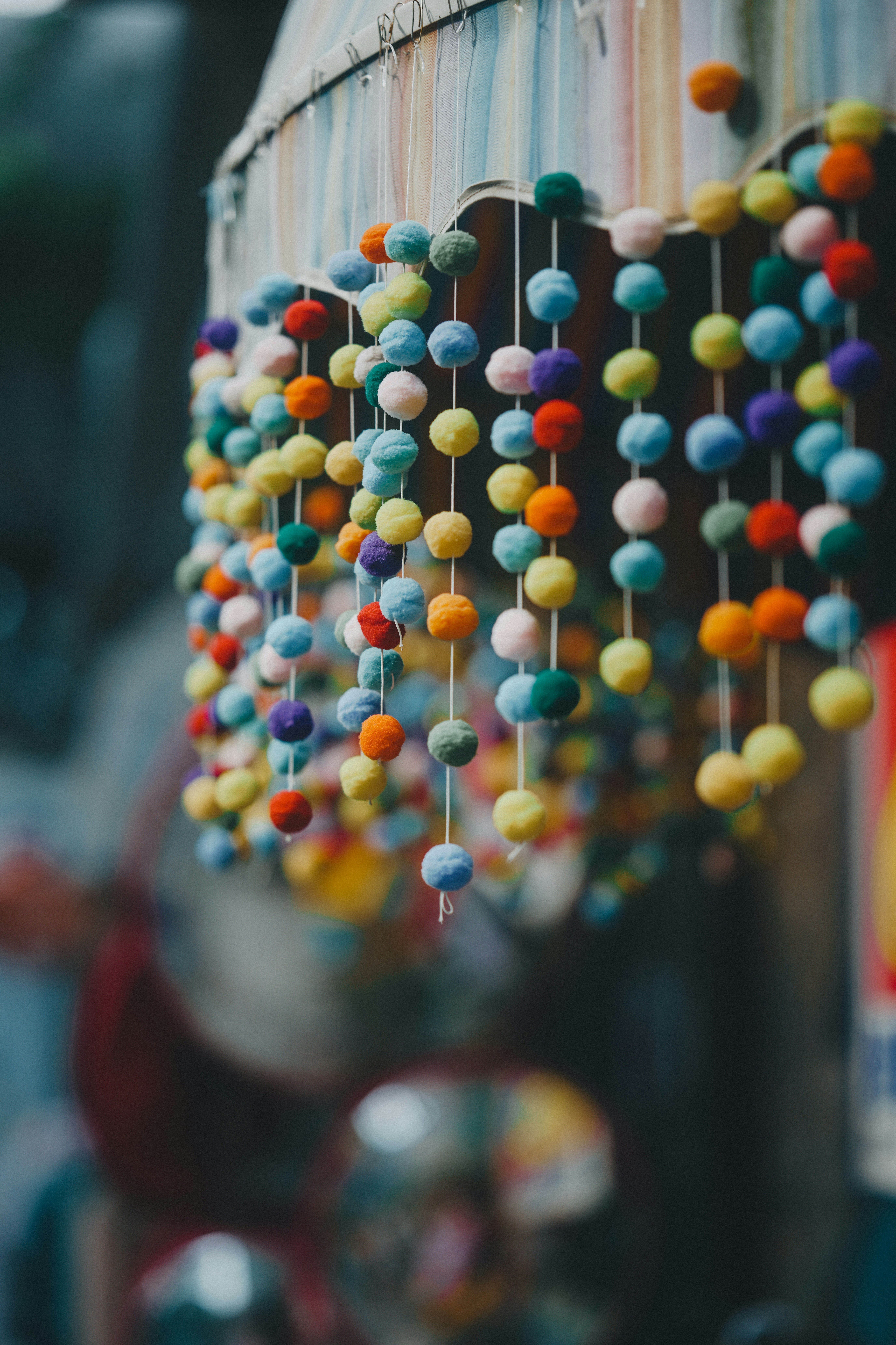 Colorful Pom-Pom Curtain in a Street Market