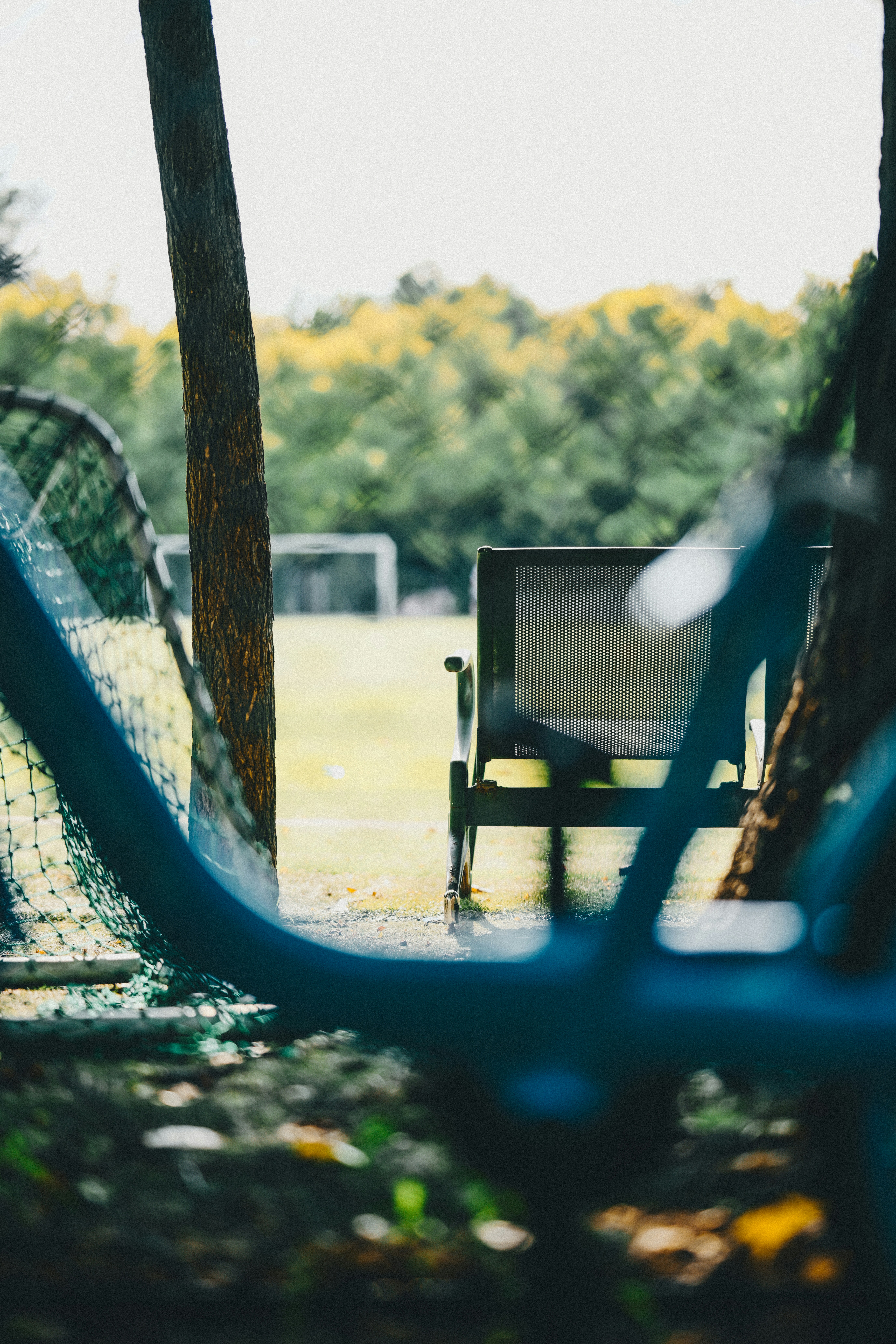 Blue Playground Shadows Framing a Park Seat