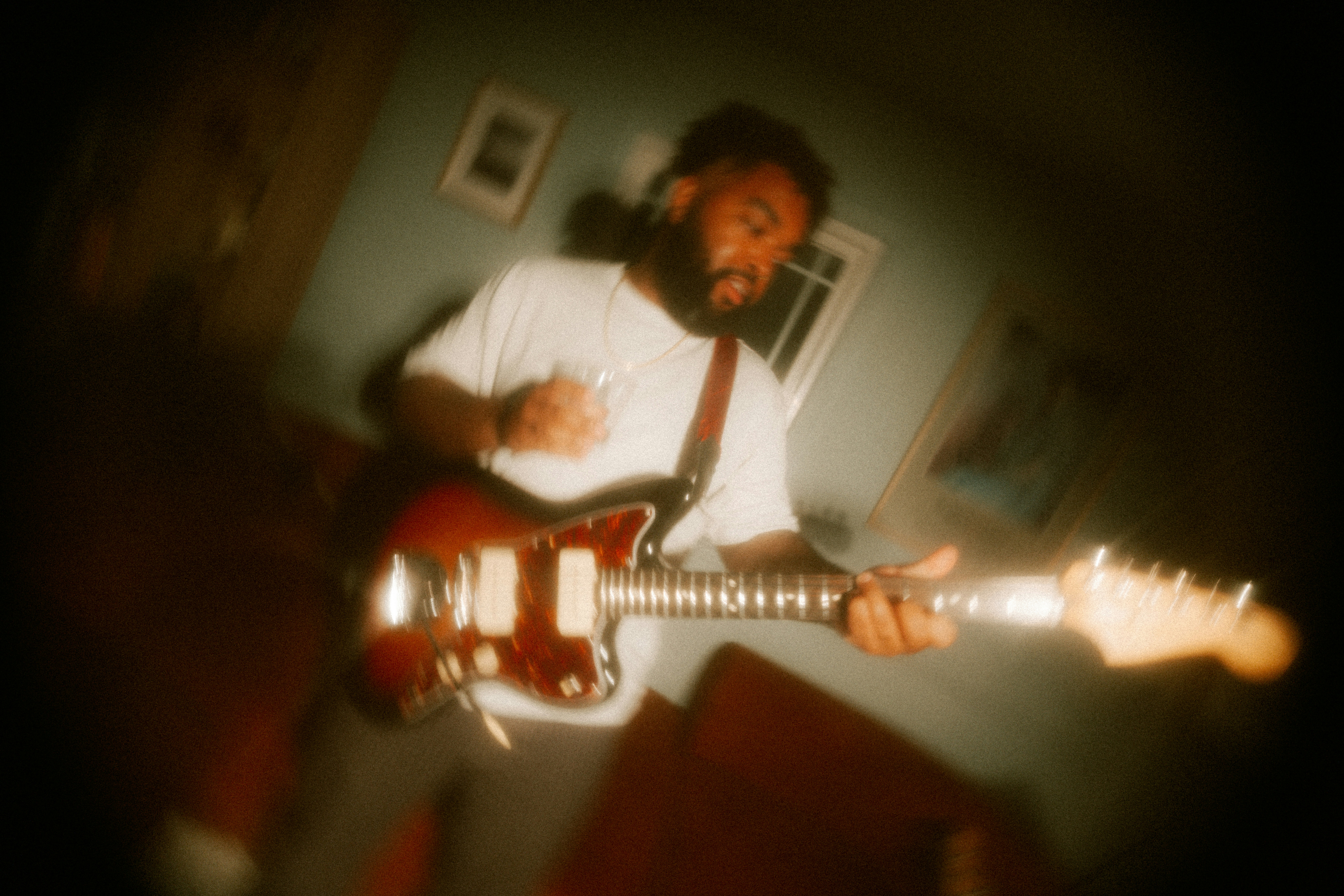 Bluesman in a Dim, Vignetted Living Room