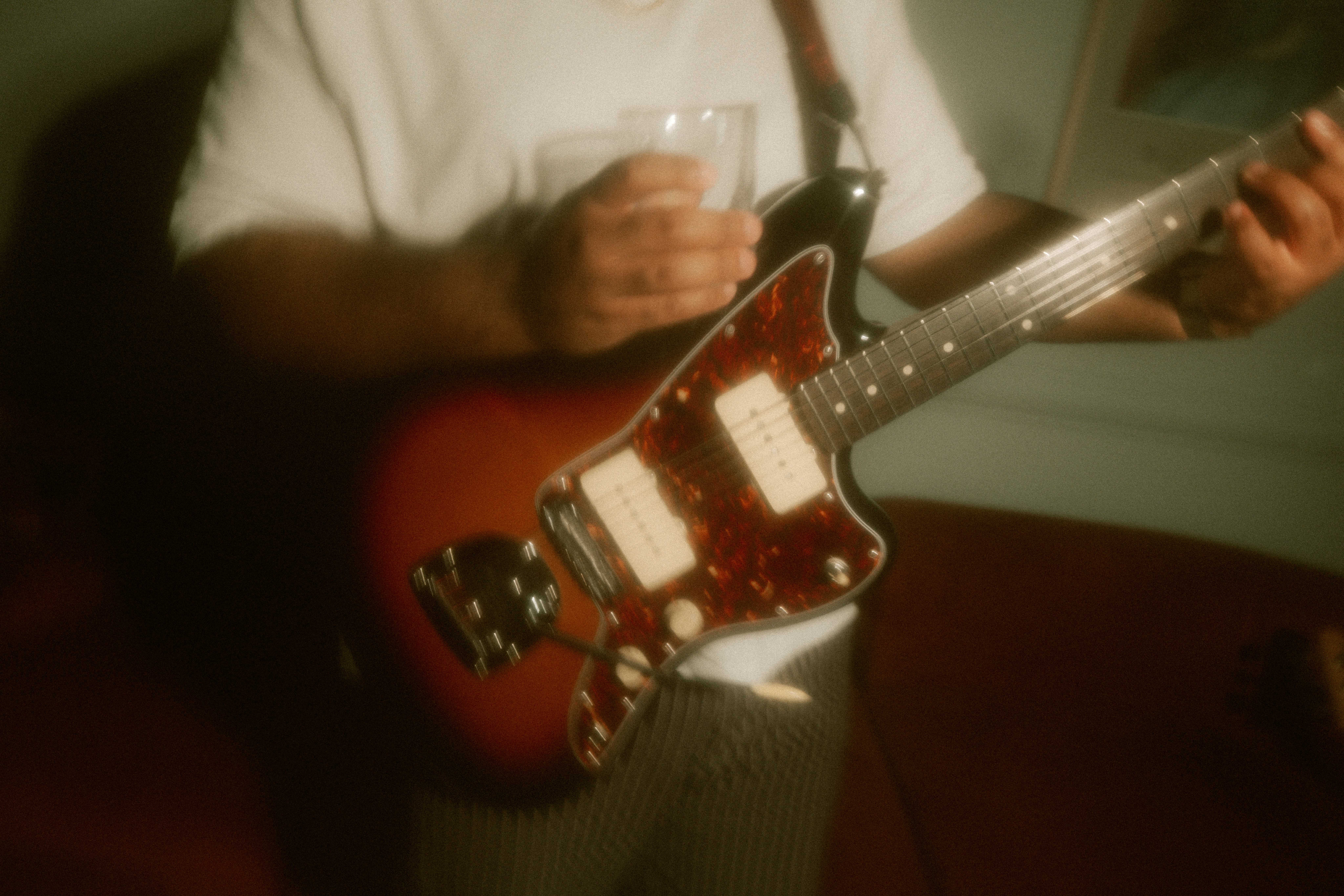 Blurry Guitar Grip in Warm Indoor Glow