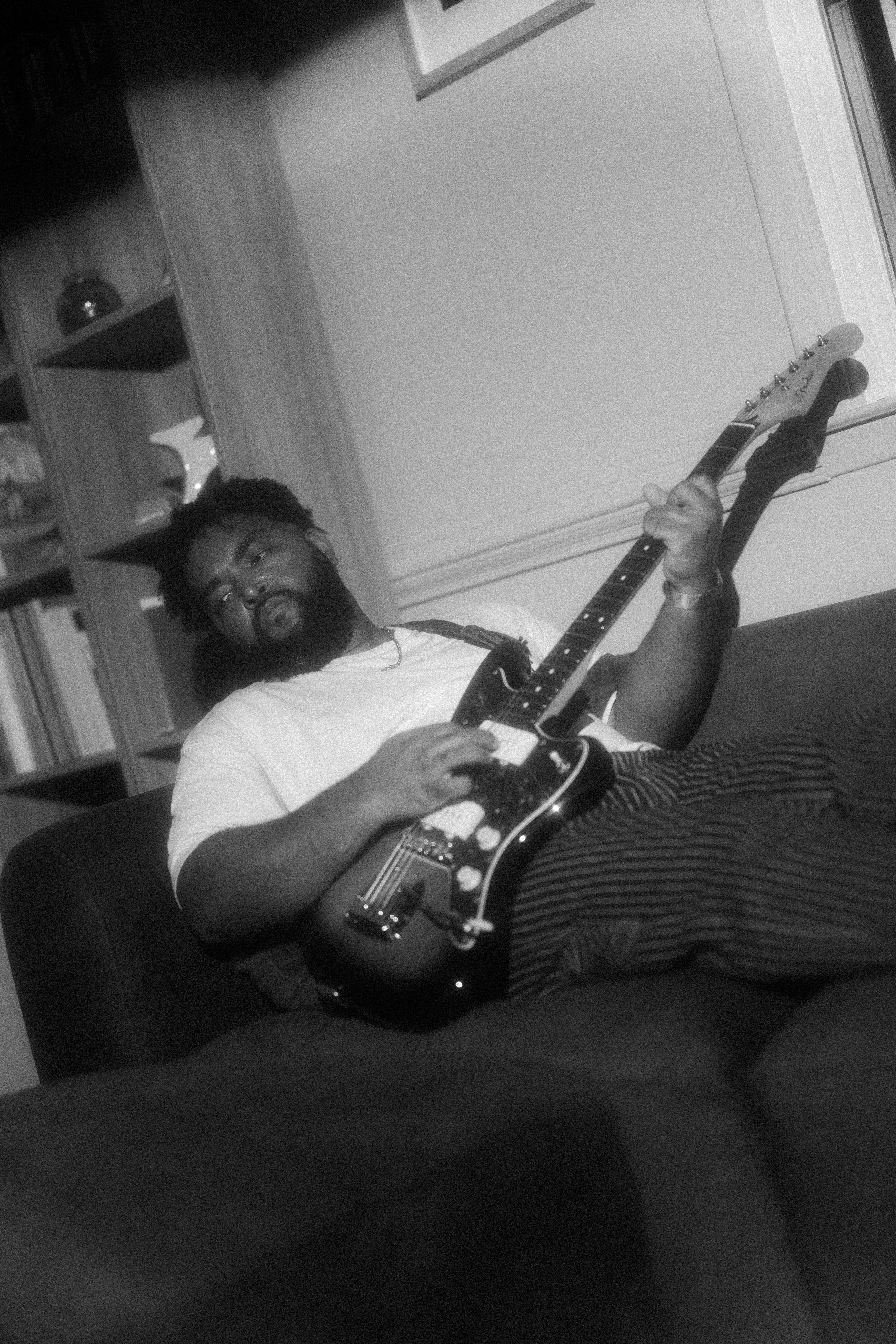 Midnight Blues: A Relaxed Guitarist On a Couch