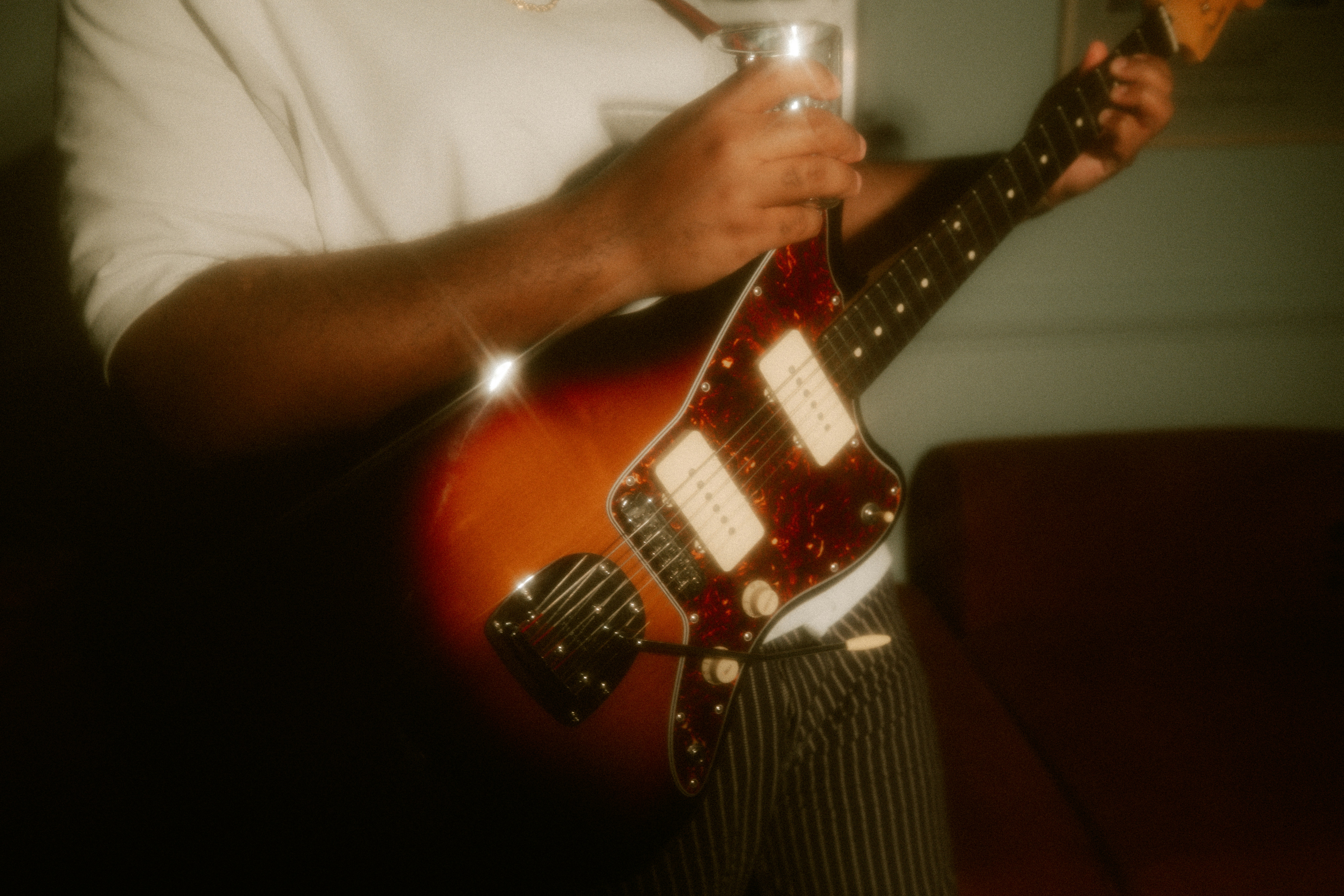 Glimmer of a Gig: Guitar in Shadowed Living Room