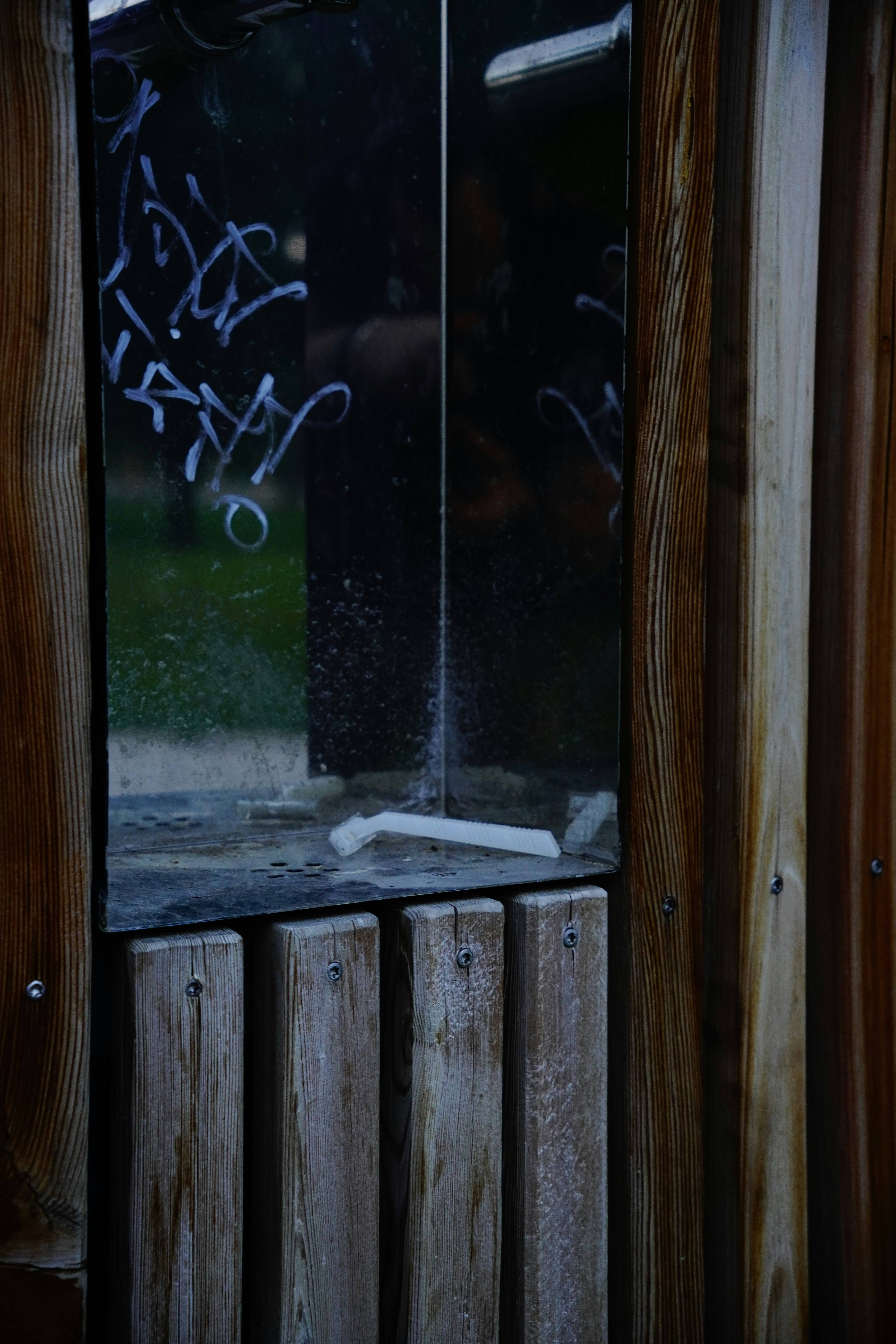 Fractured Glass and Weathered Wood at Dusk