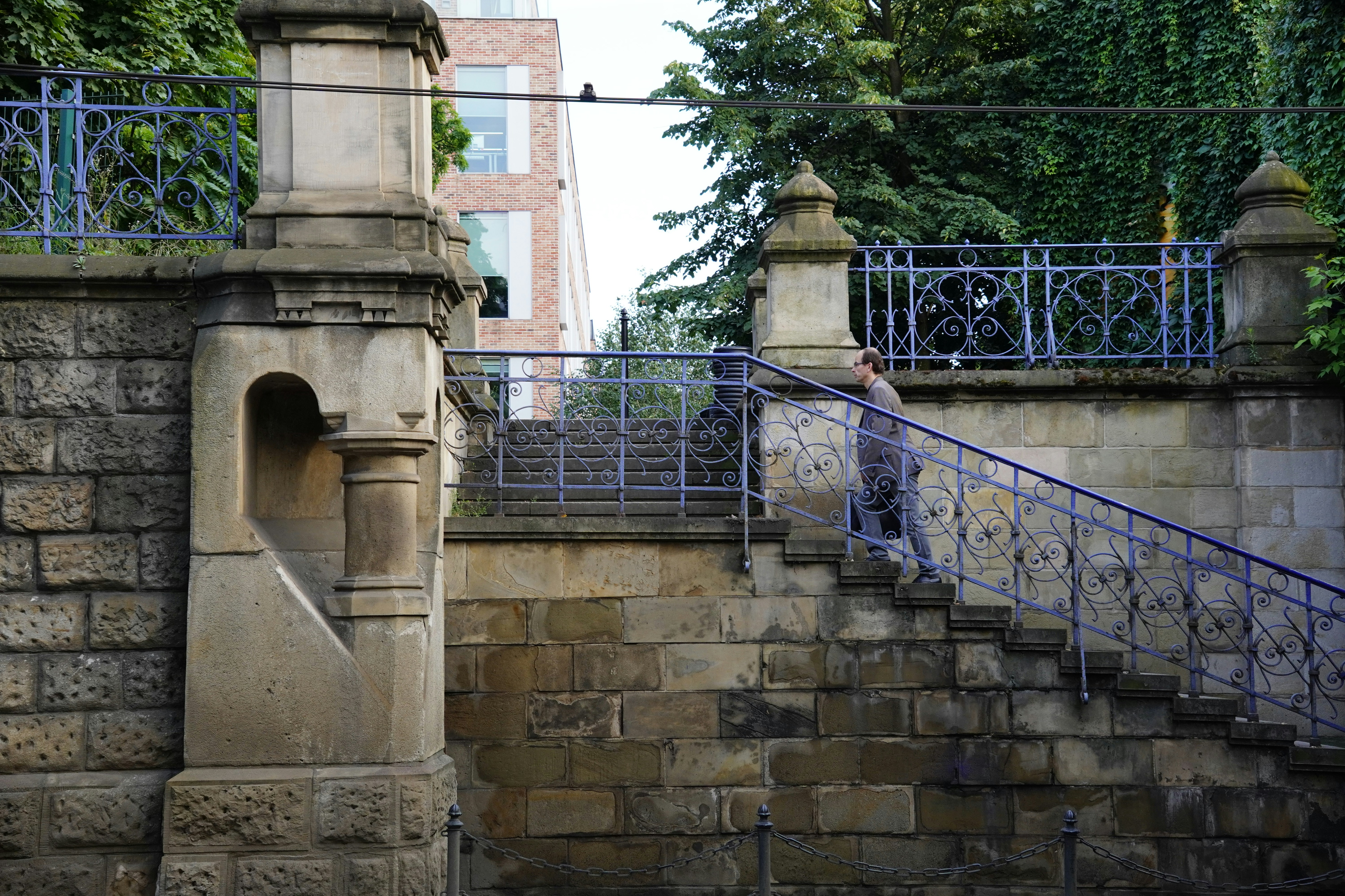 Stone Staircase and Ironwork Bridge Over a Walled Terrace