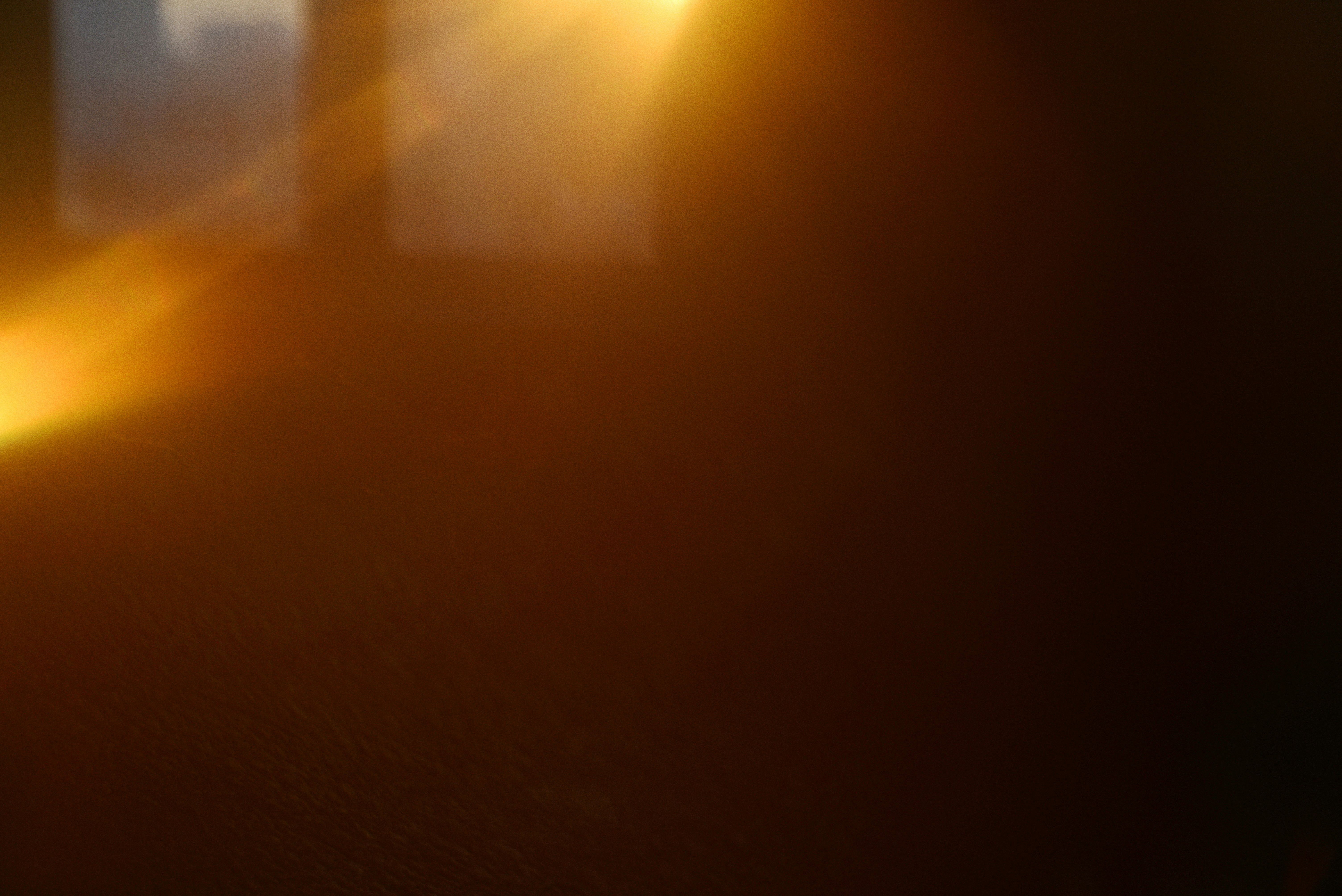 Warm Blur: Evening Light on a Leather Surface