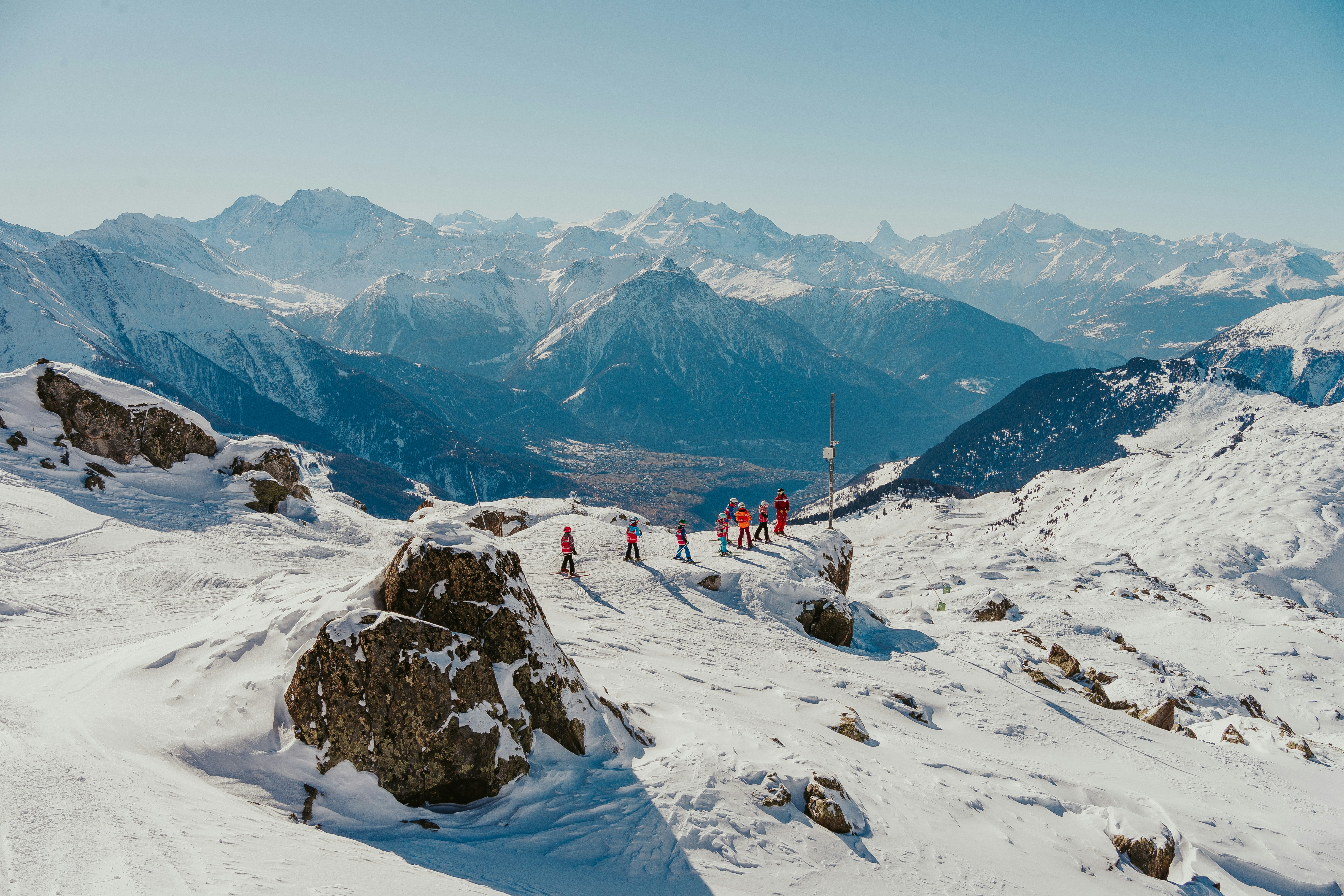 Snowbound Ridge: A Line of Climbers Against the Alpine Expanse