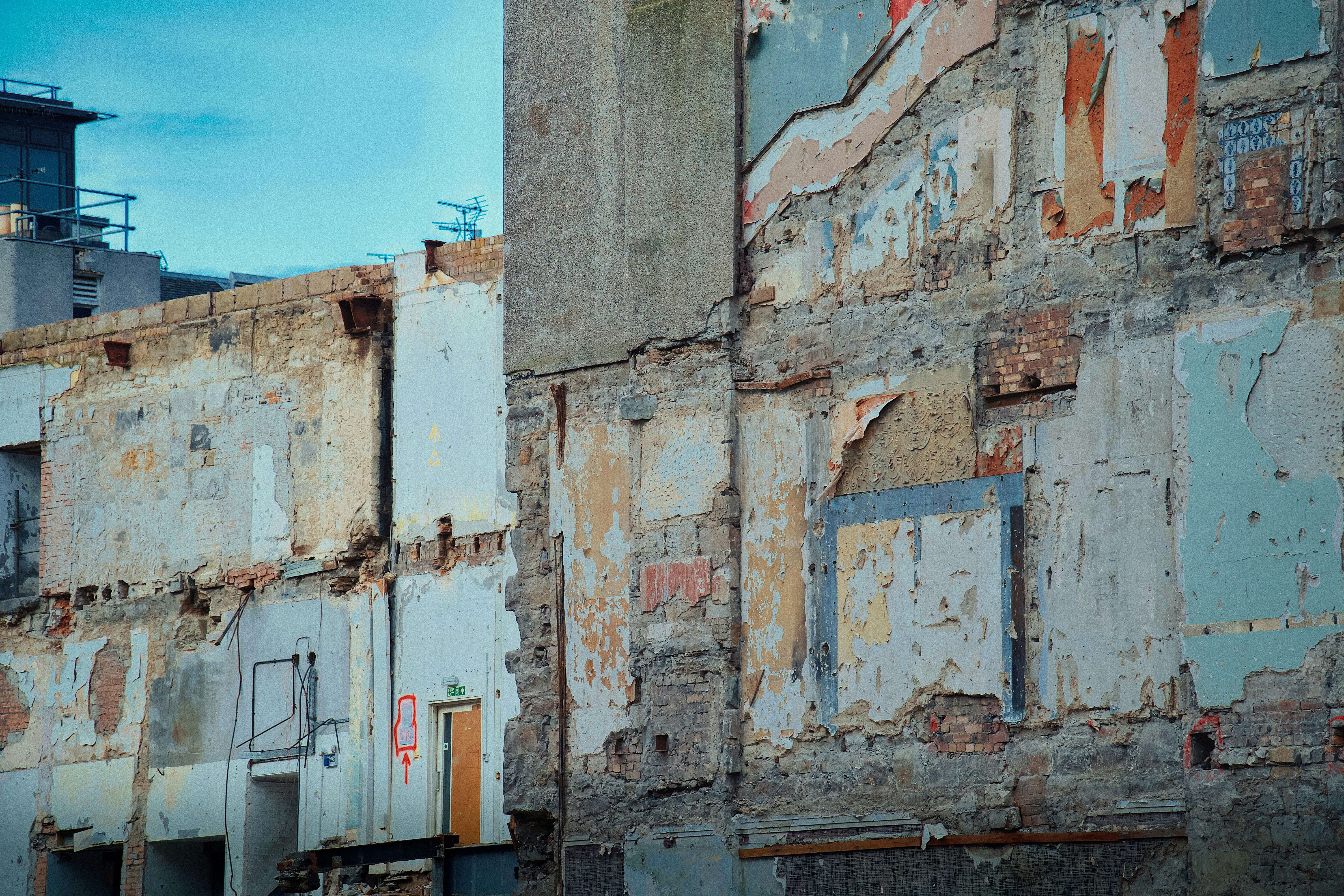 Urban Weathered Facade: Stacked Panels and Peeling Paint