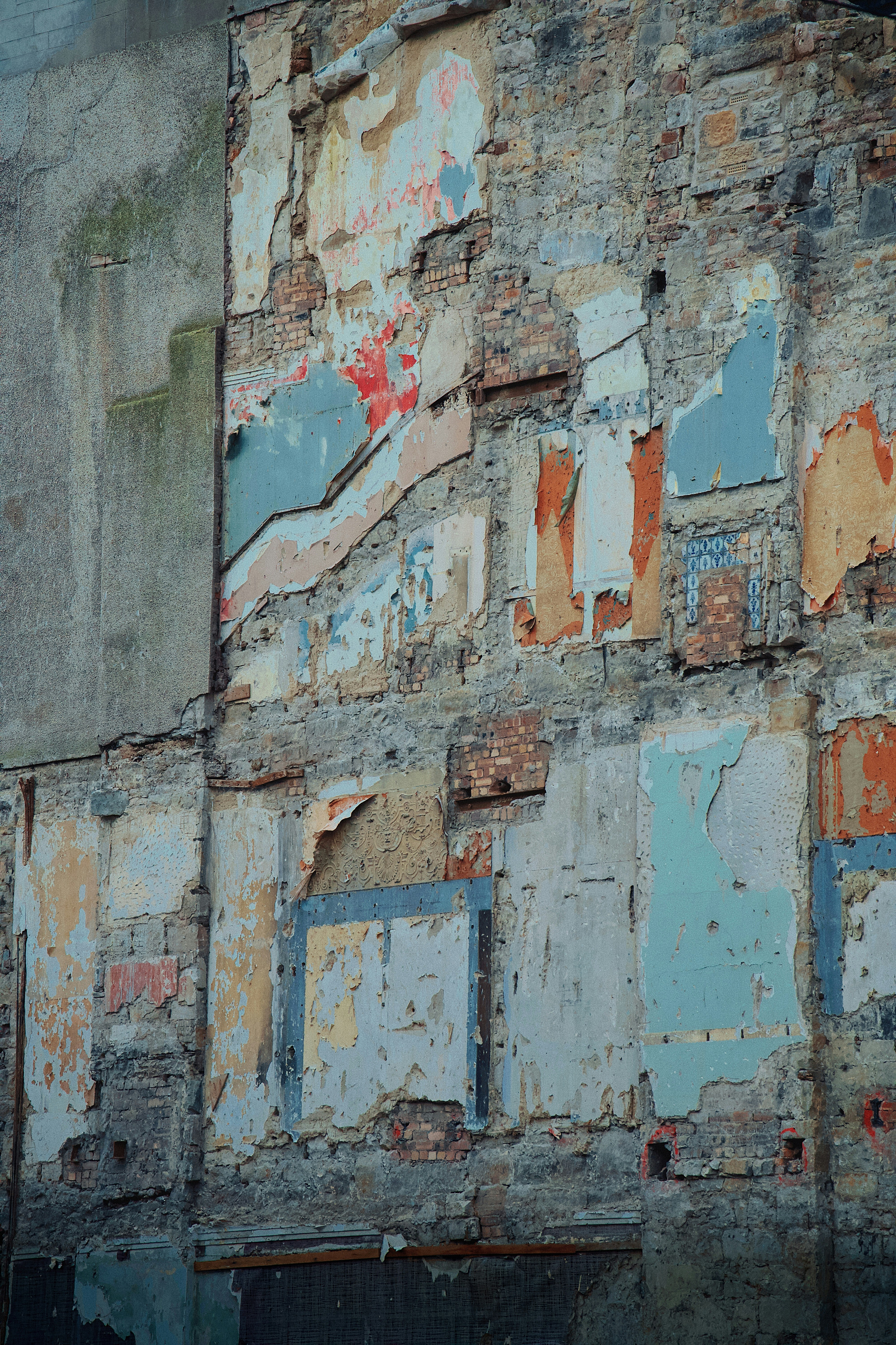 Patchwork of Weathered Color on a Crumbling Wall