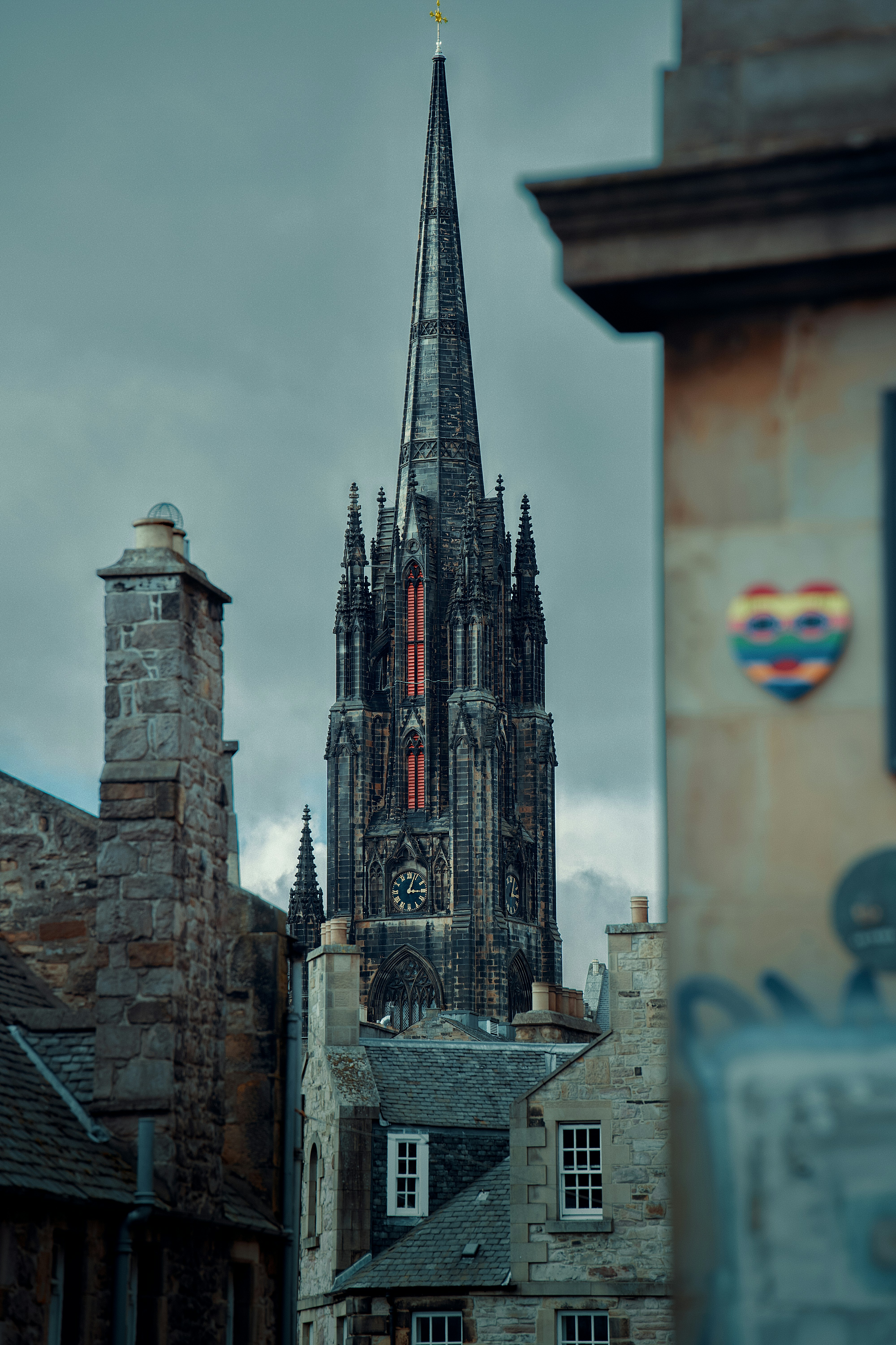Gothic Spire Piercing a Narrow Rooftop Corridor