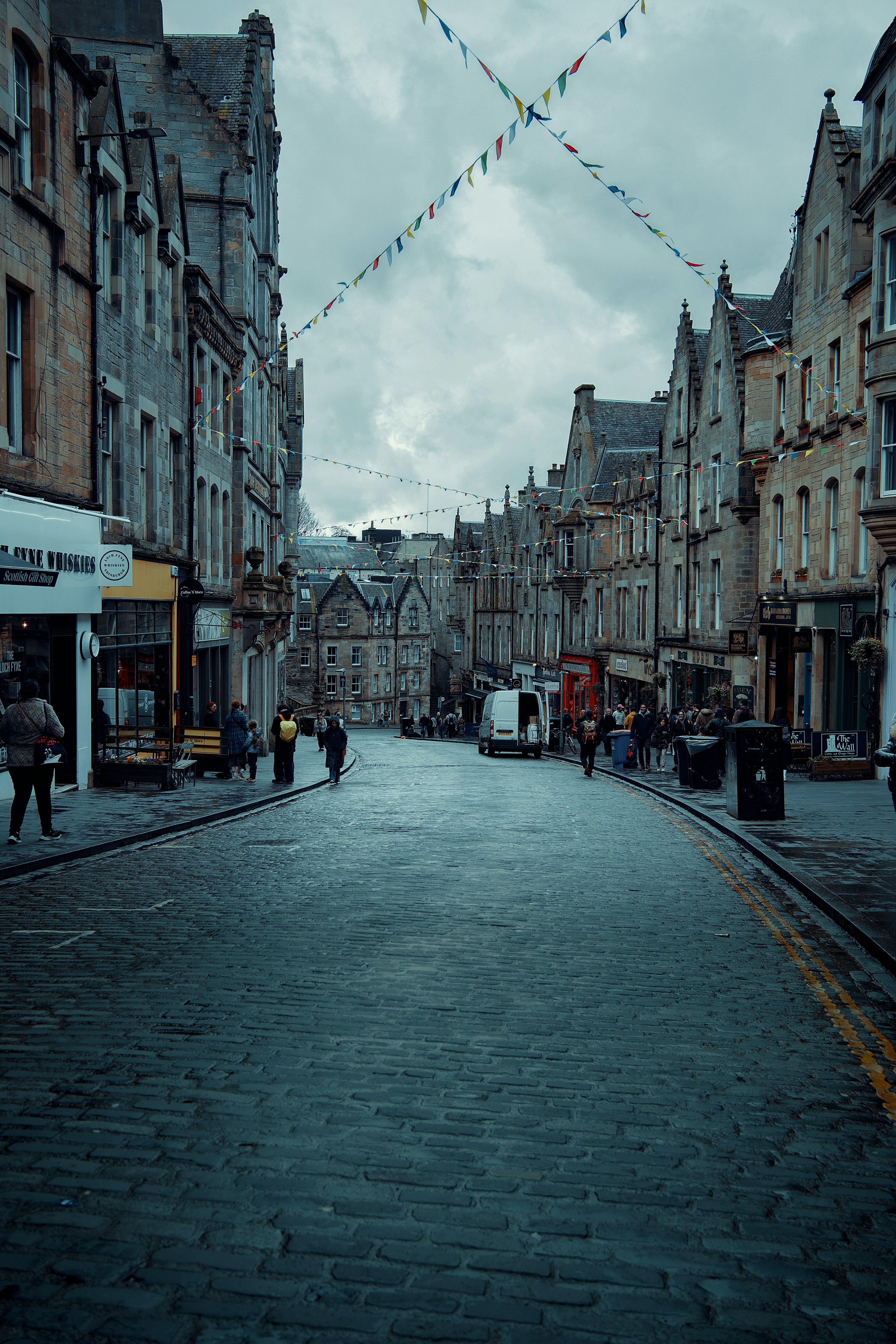Cobbled Street Under Festive Stripes