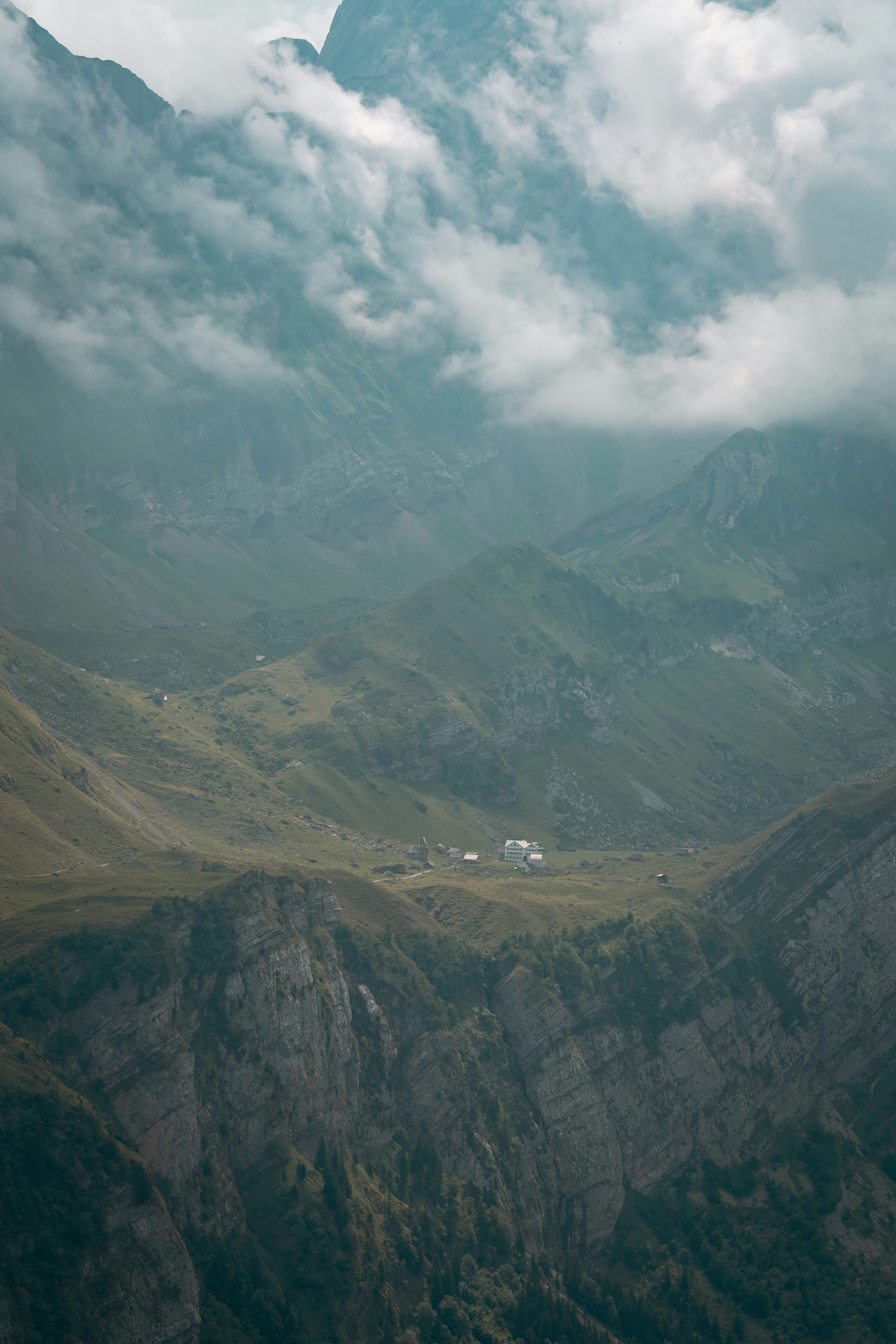 Alpine Ridge Farmstead Beneath Brooding Skies