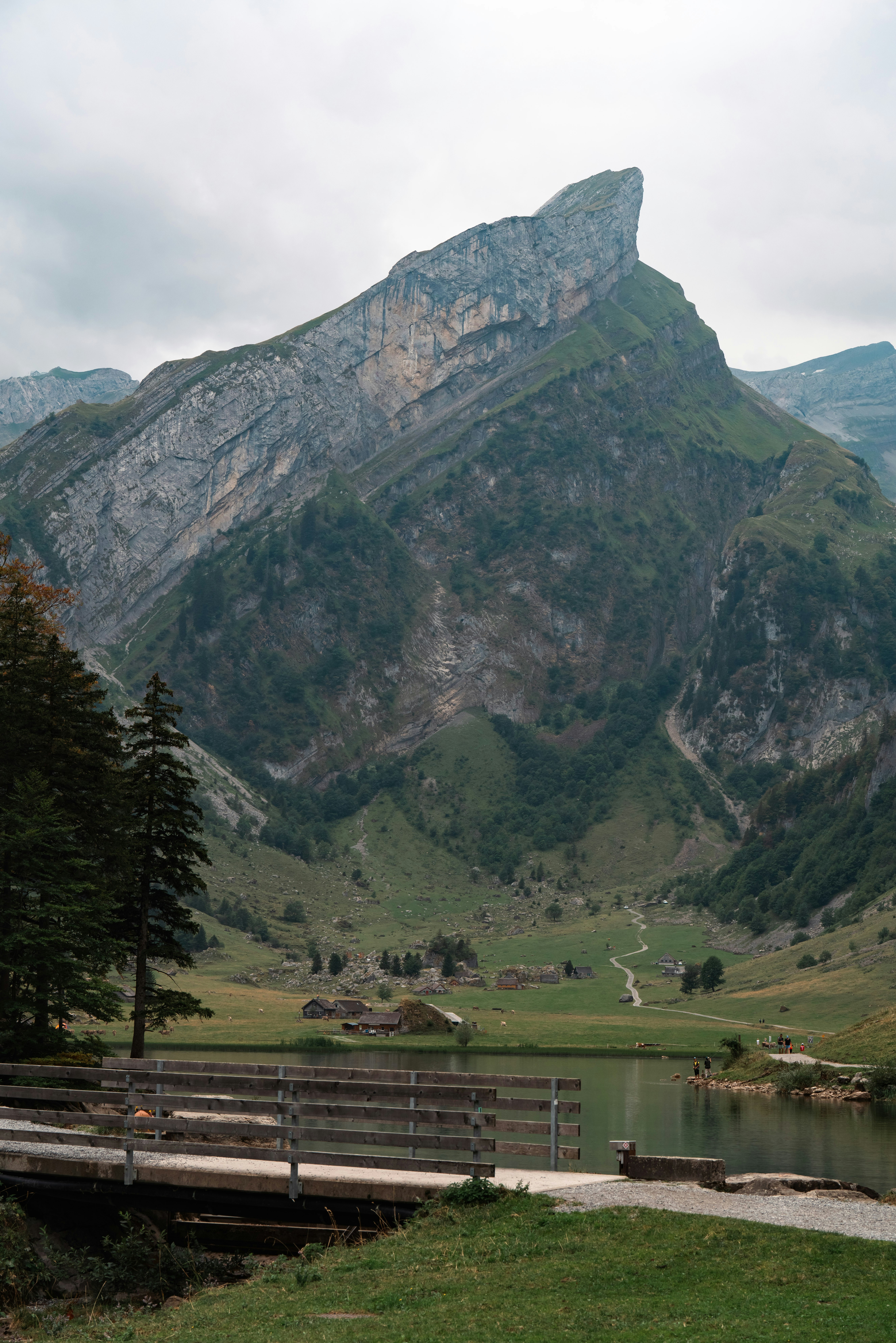 Majestic alpine peak guarding a tranquil valley village
