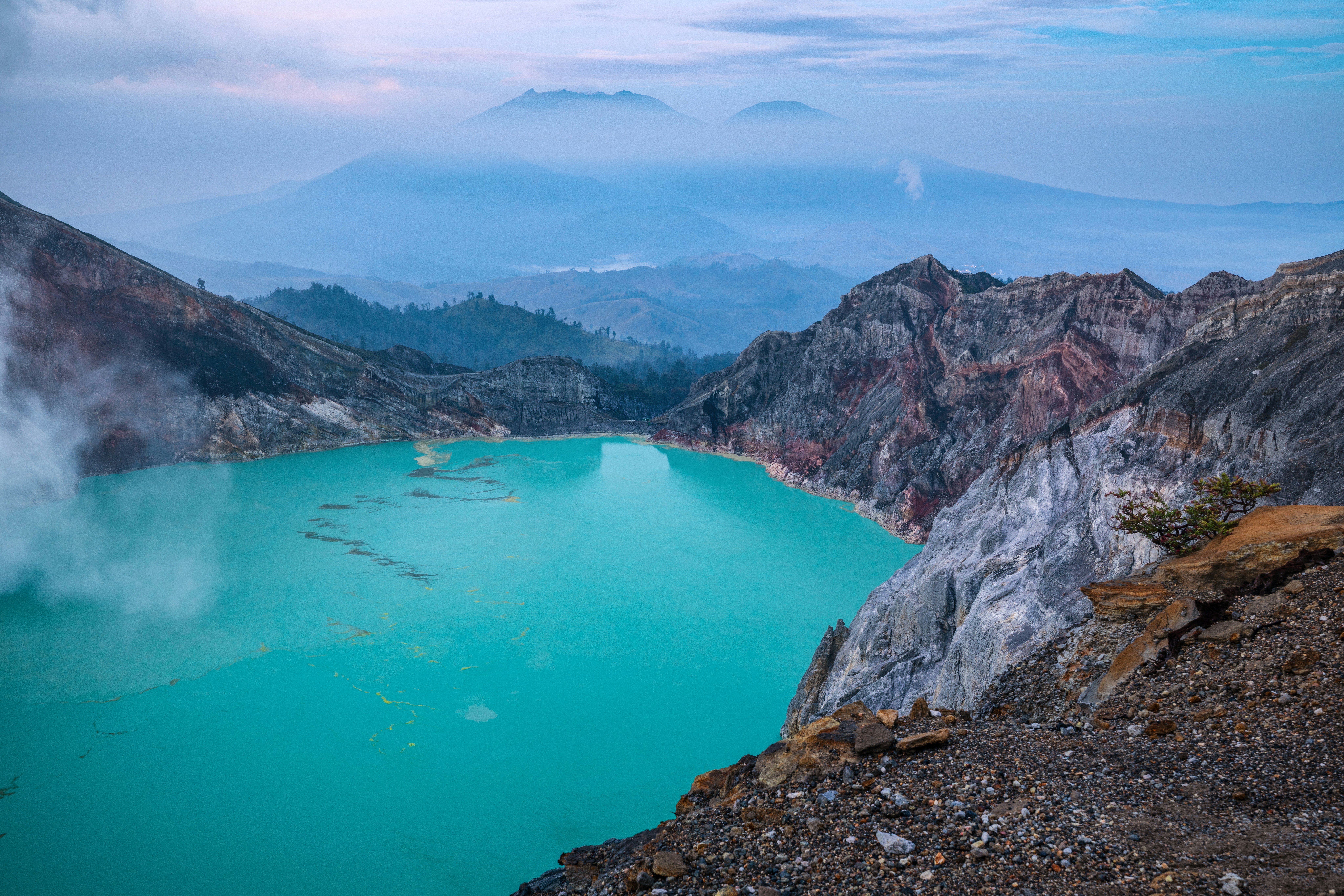 Emerald Crater Rim: Steam, Rock, and Mist