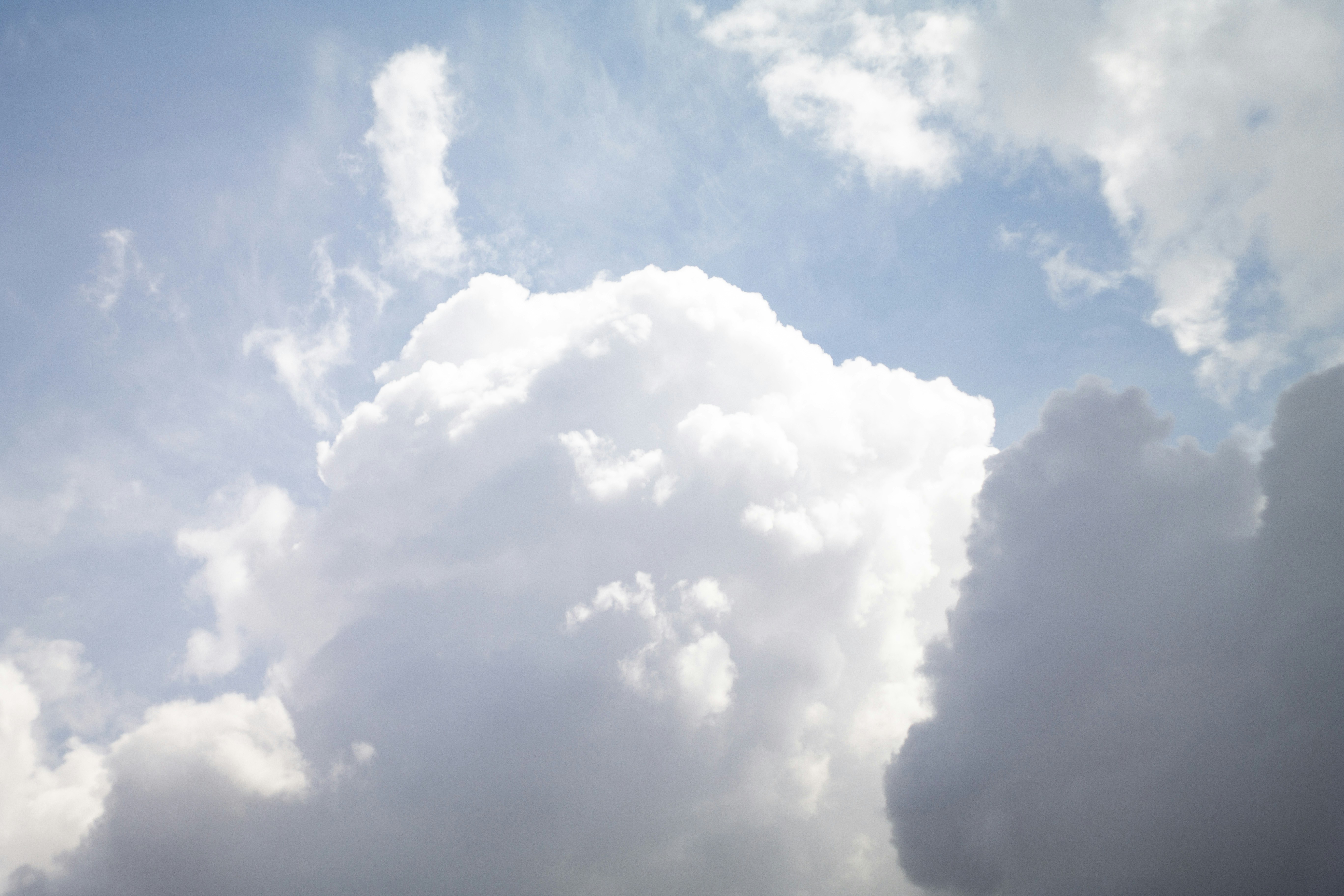 Sunlit Cloud Cathedral Rising Over a Quiet Sky
