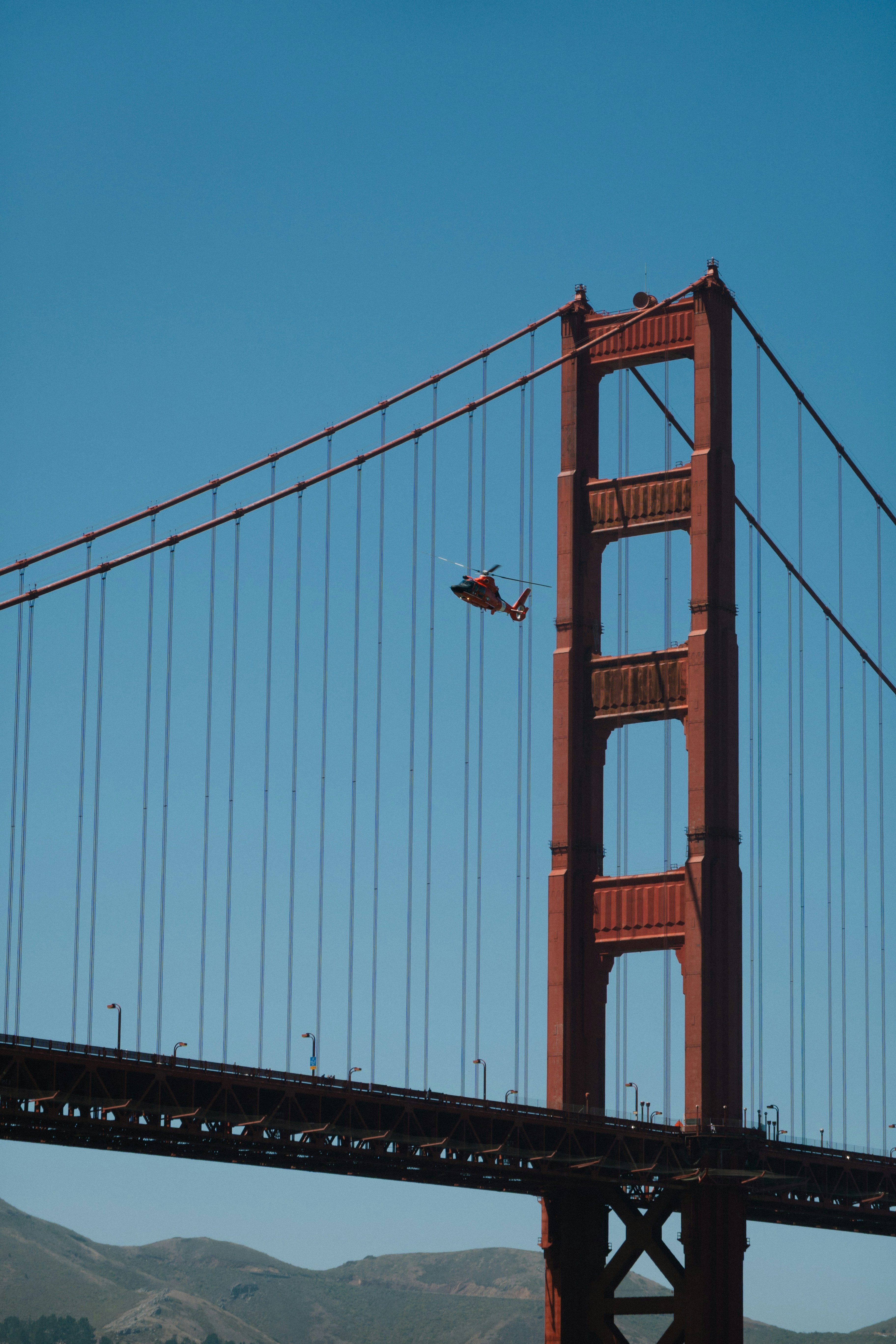 Rope Bridge Silence: A helicopter adrift over the Golden Gate