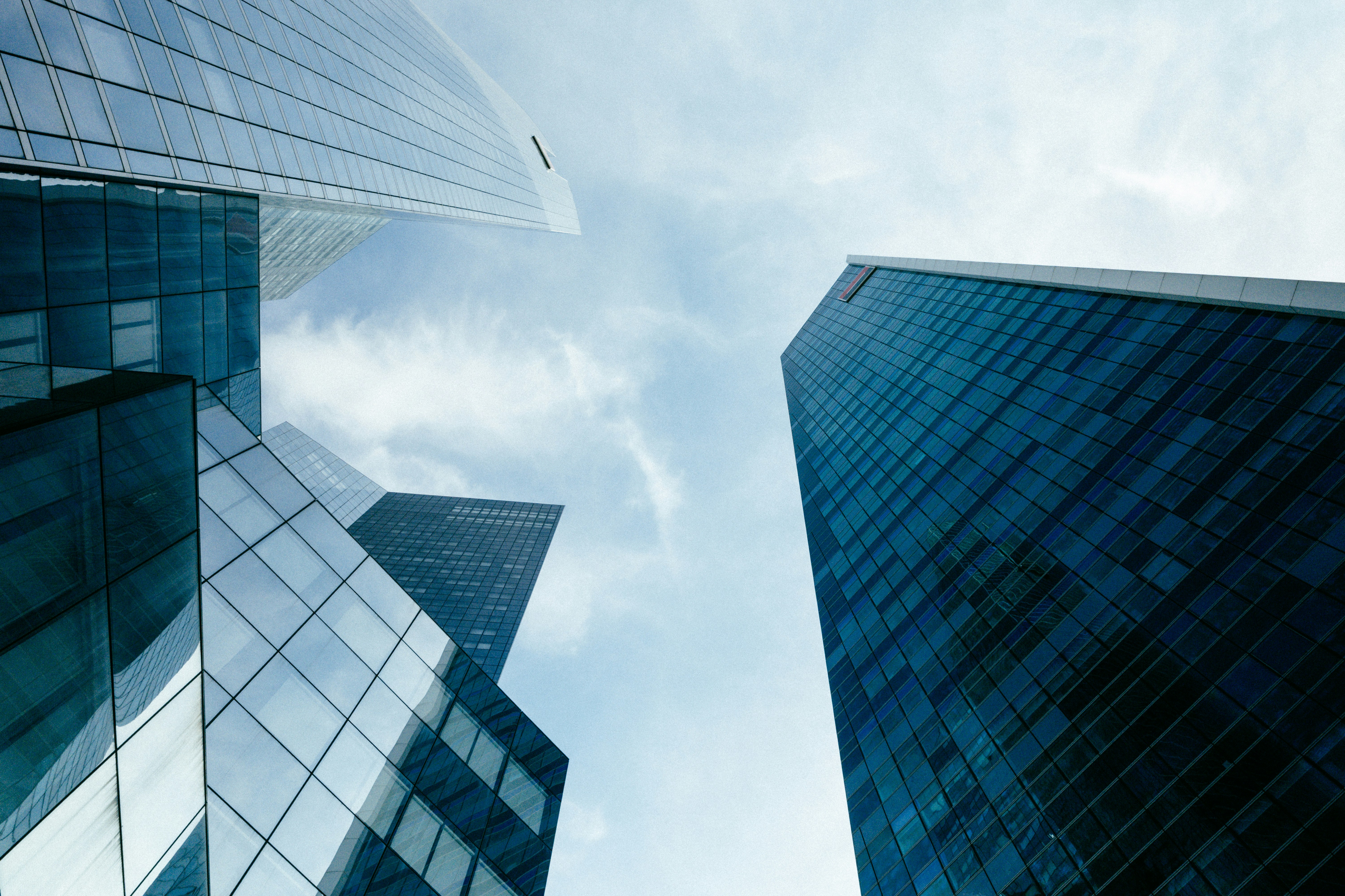 Skyward Convergence: Urban Glass and Sky