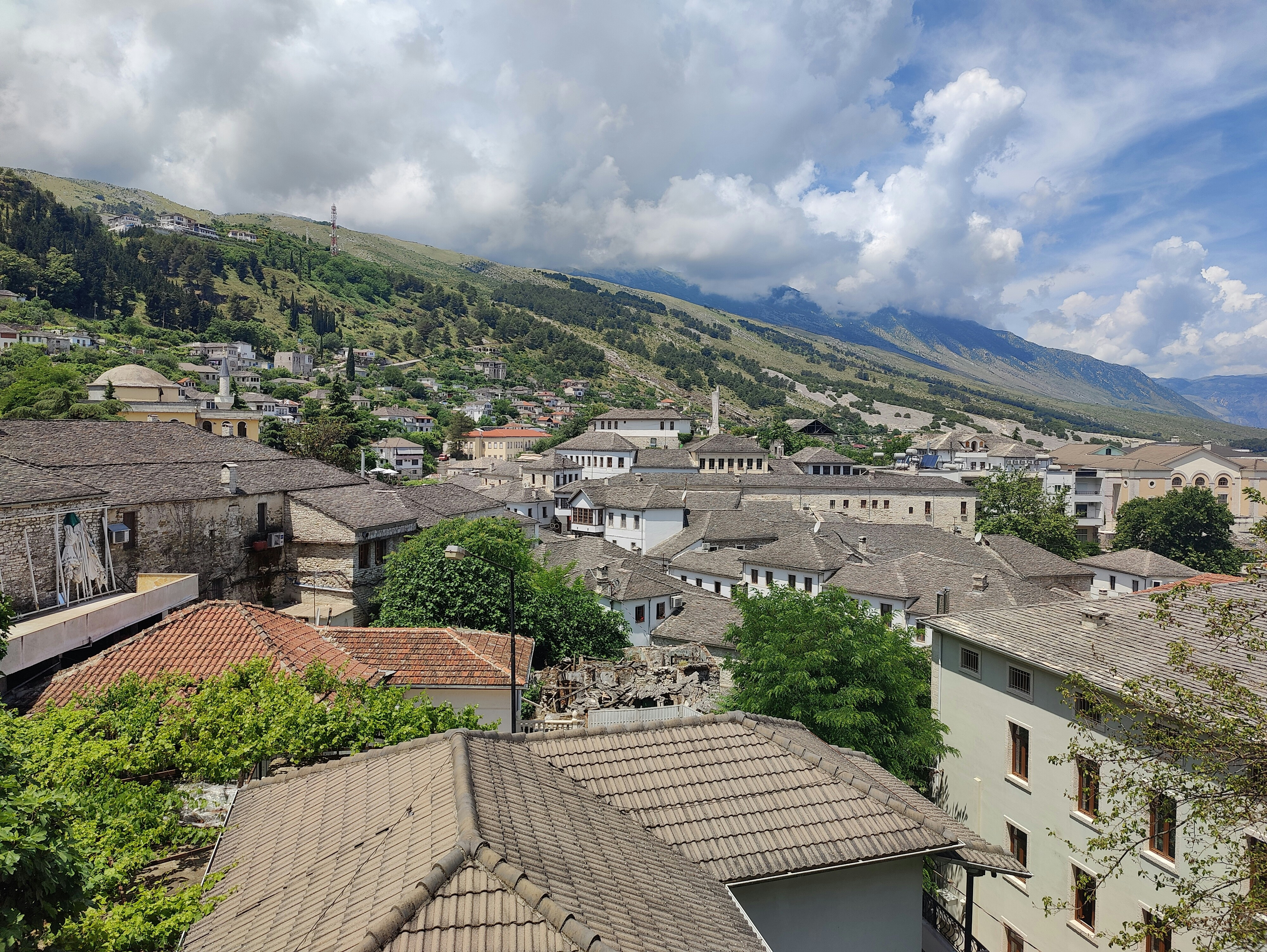 Terracotta Rooftops Beneath Alpine Skies
