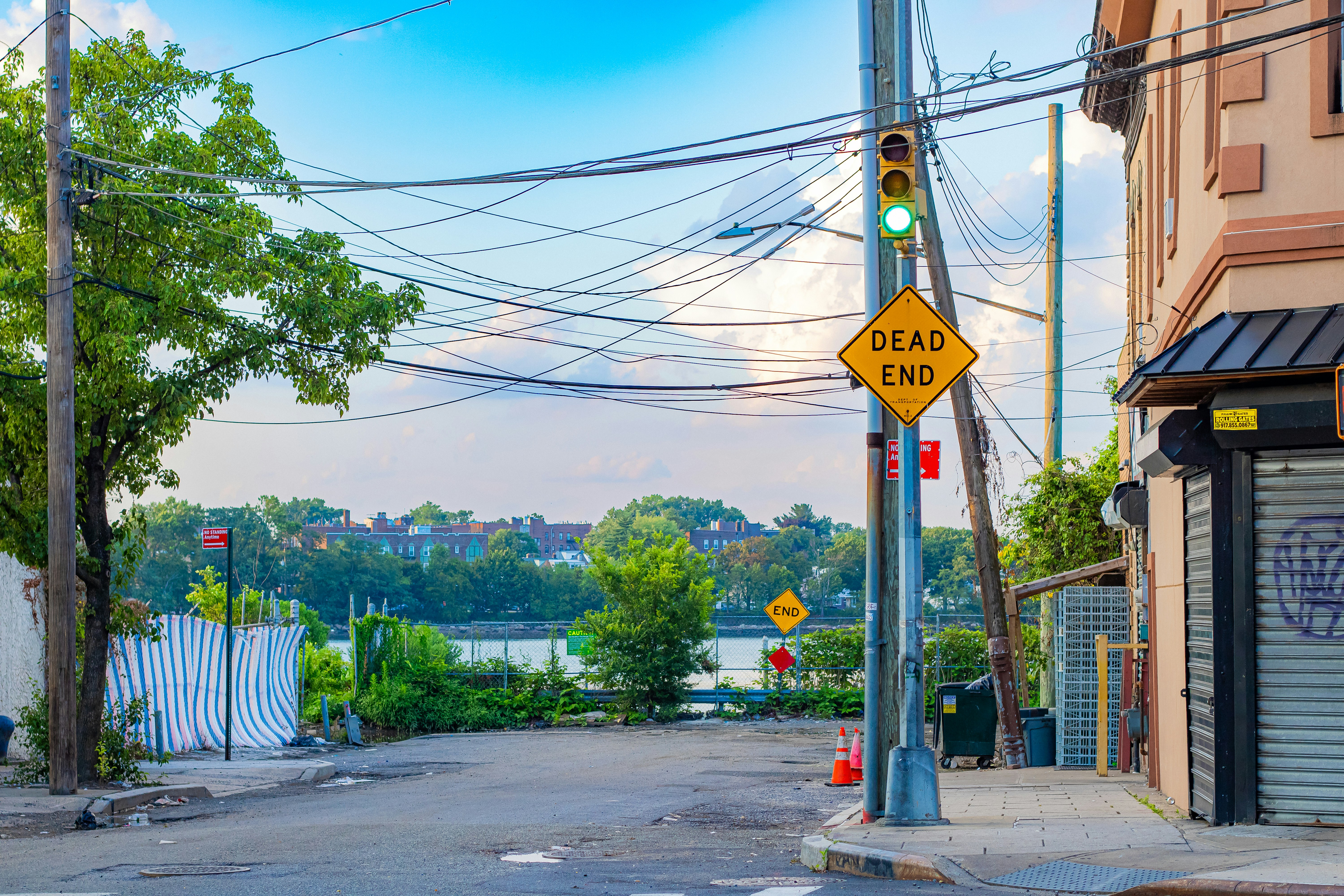 City Edge at Dead End: Neon Light and Quiet Street