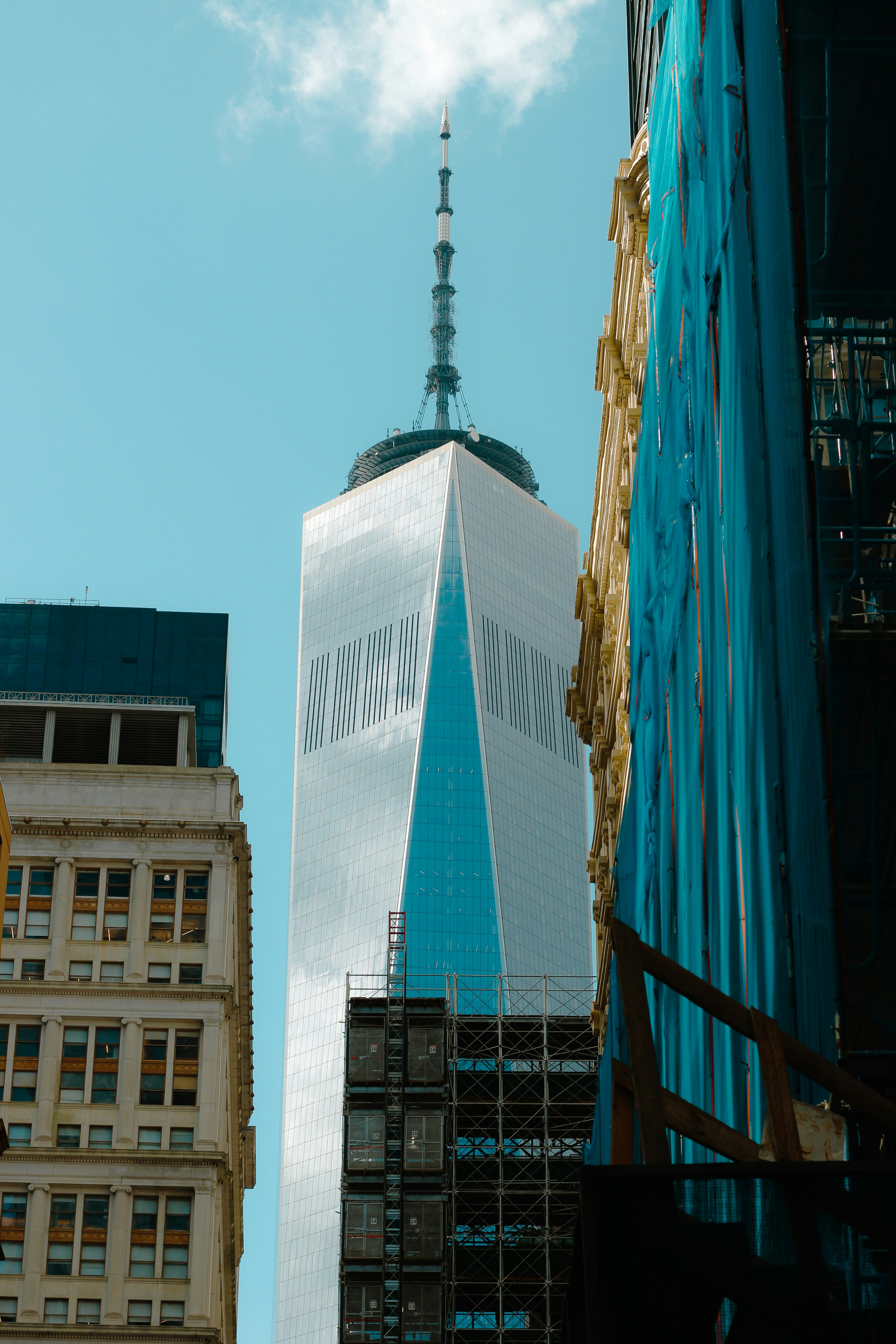 Stalwart Spire: One World Tower Ascends Between City Facades