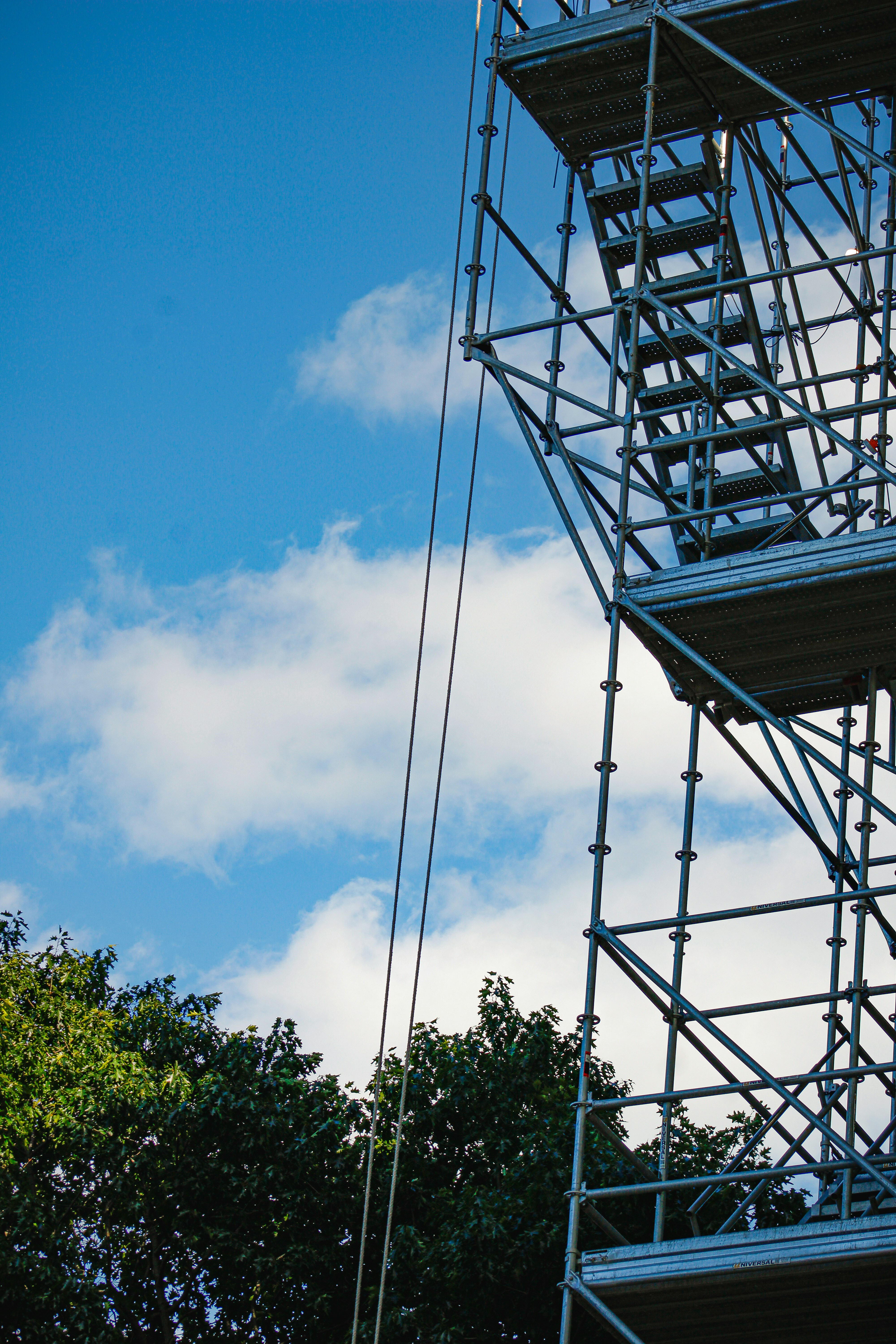 Steel Skeleton against a Blue Sky: Towering Structure Reaches for the Clouds