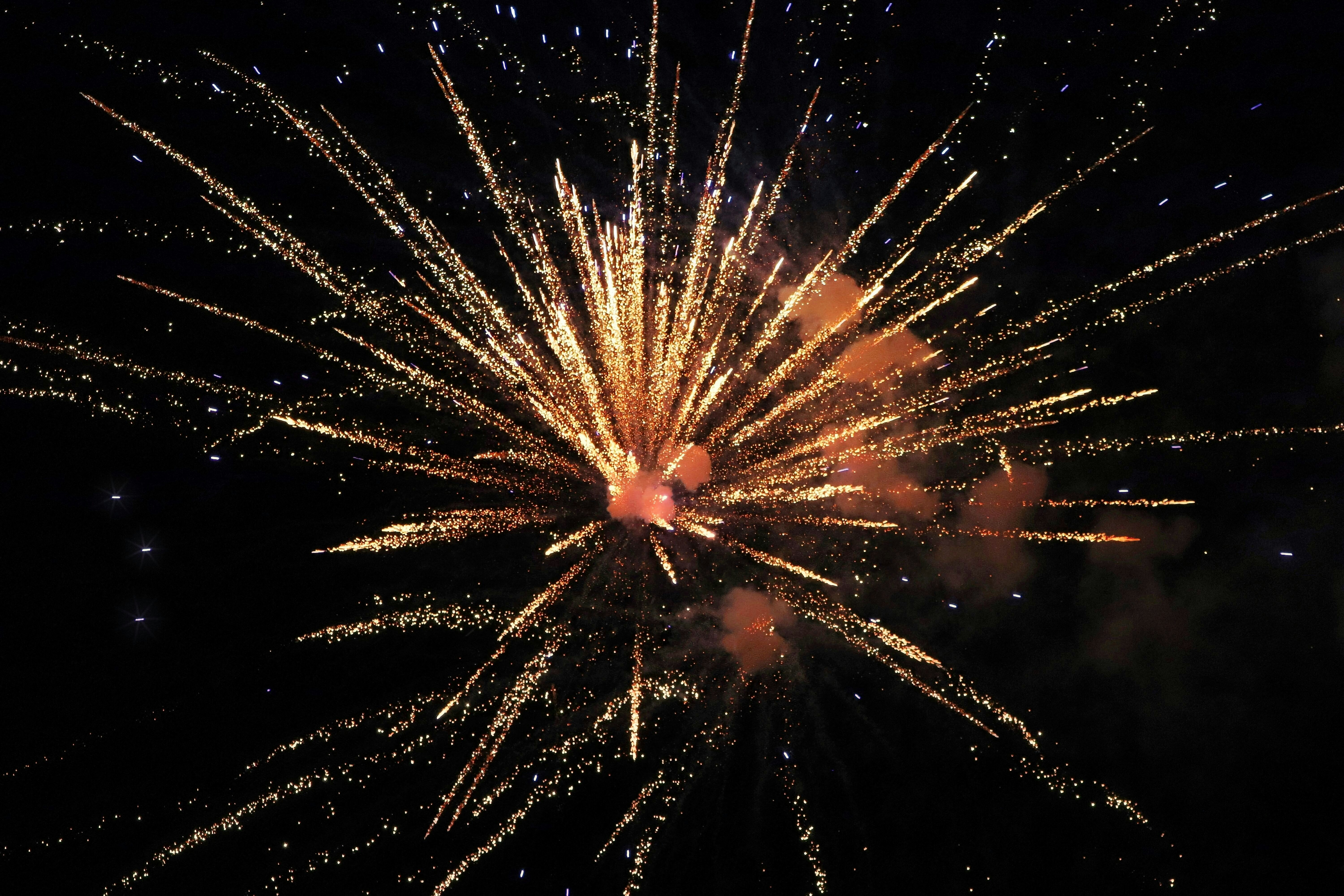 Midnight Burst: A Lone Firework Illuminates the Night Sky