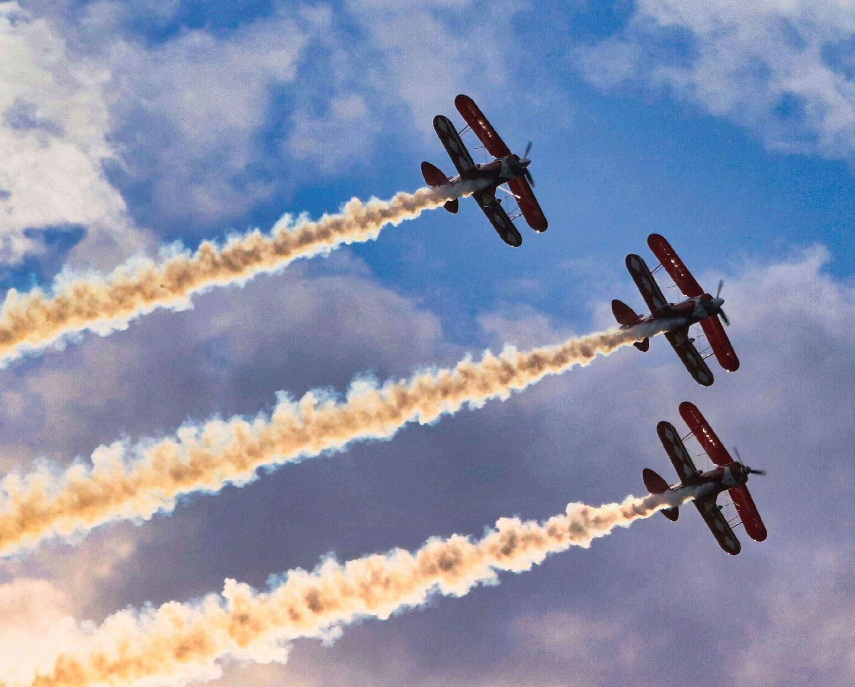 Tri-Blue Skies: Three Aerobatic Contrails in Synchrony