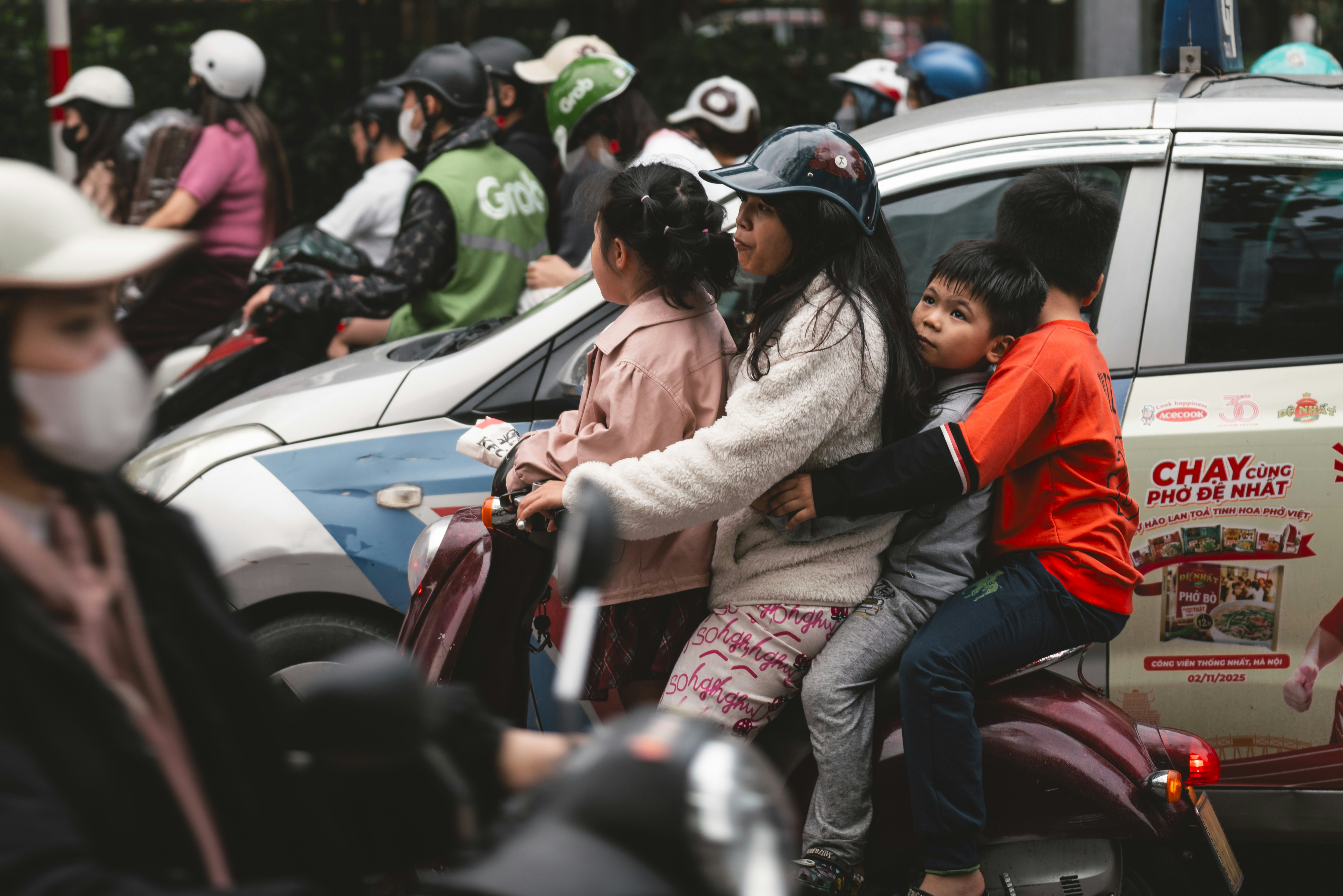 Riders on a City Bus: A Multicolored Mass of motion and faces
