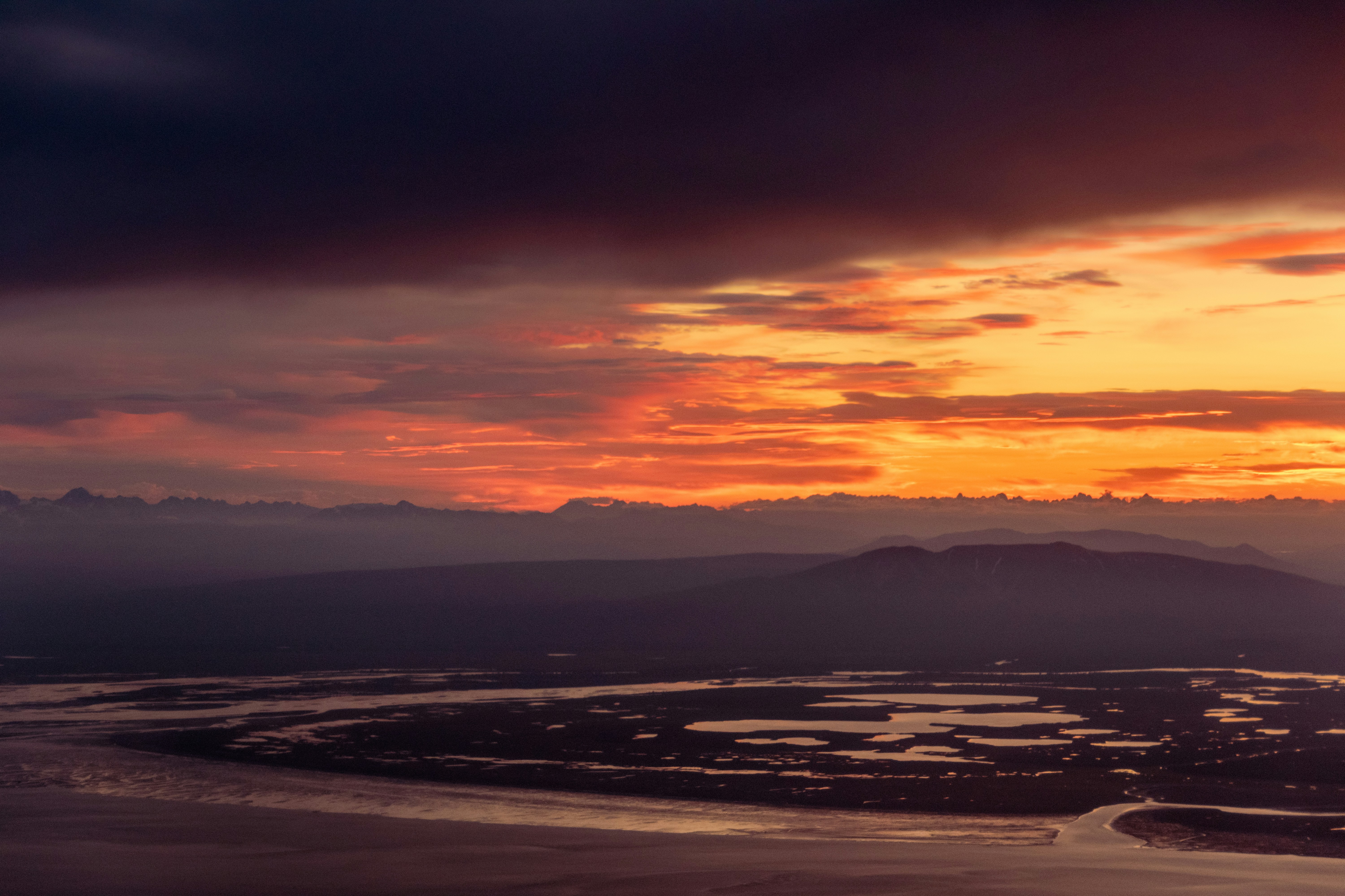 Sunset Mirage Over Tidal Flats