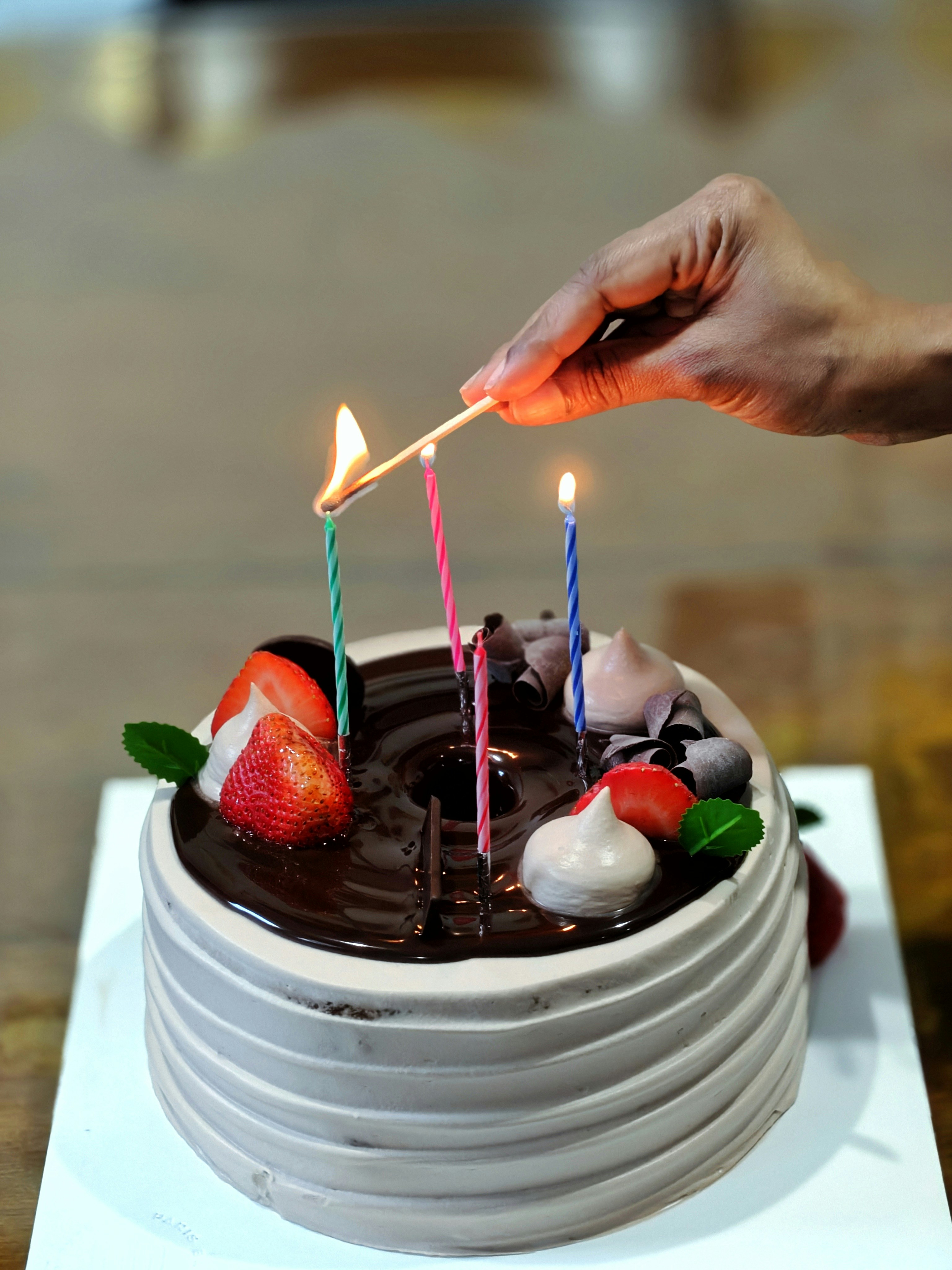 Candlelight Celebration: A Chocolate Cake in Focus