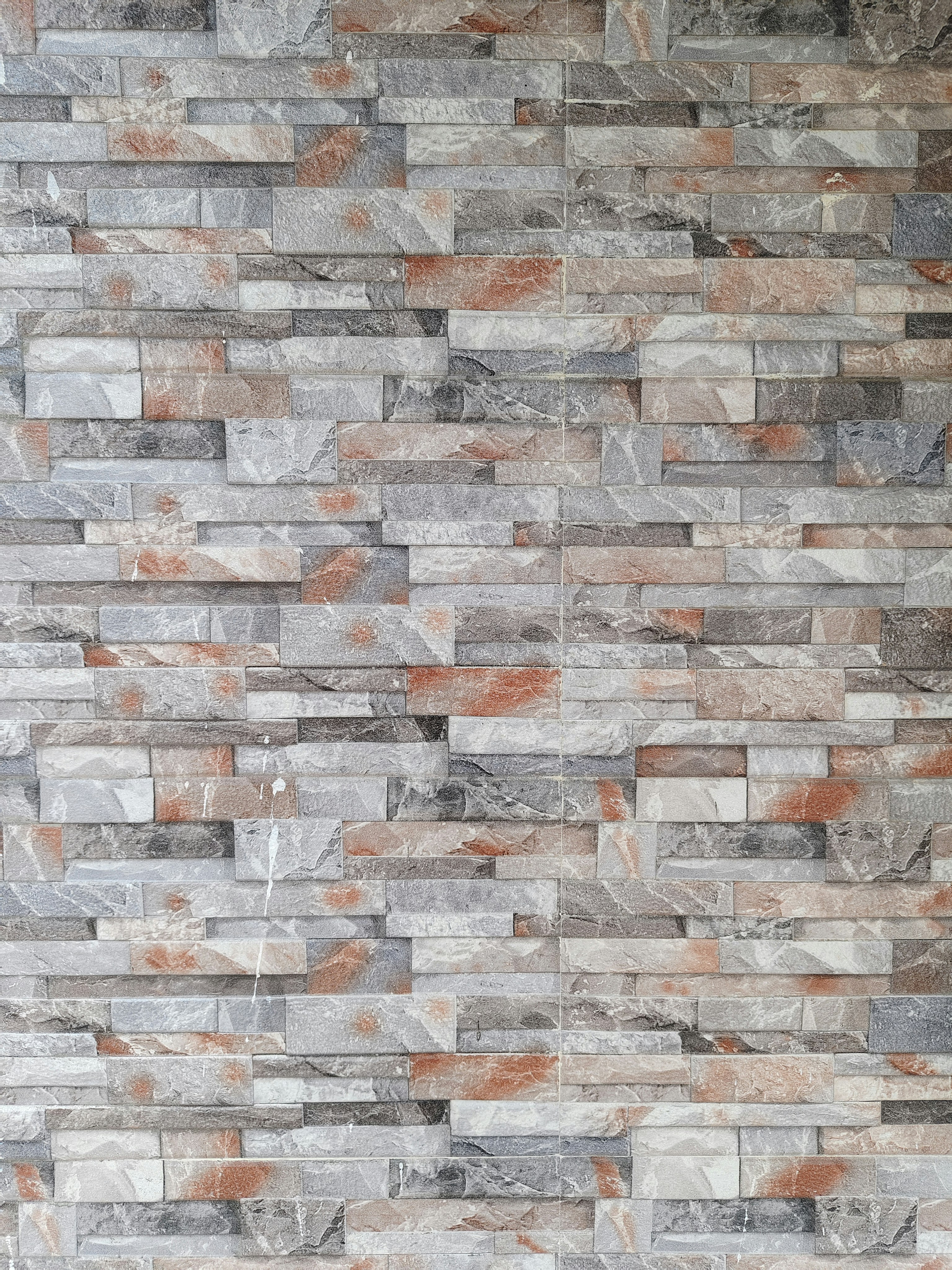 Layered Granite Mosaic: A Quiet Wall of Stone Hues