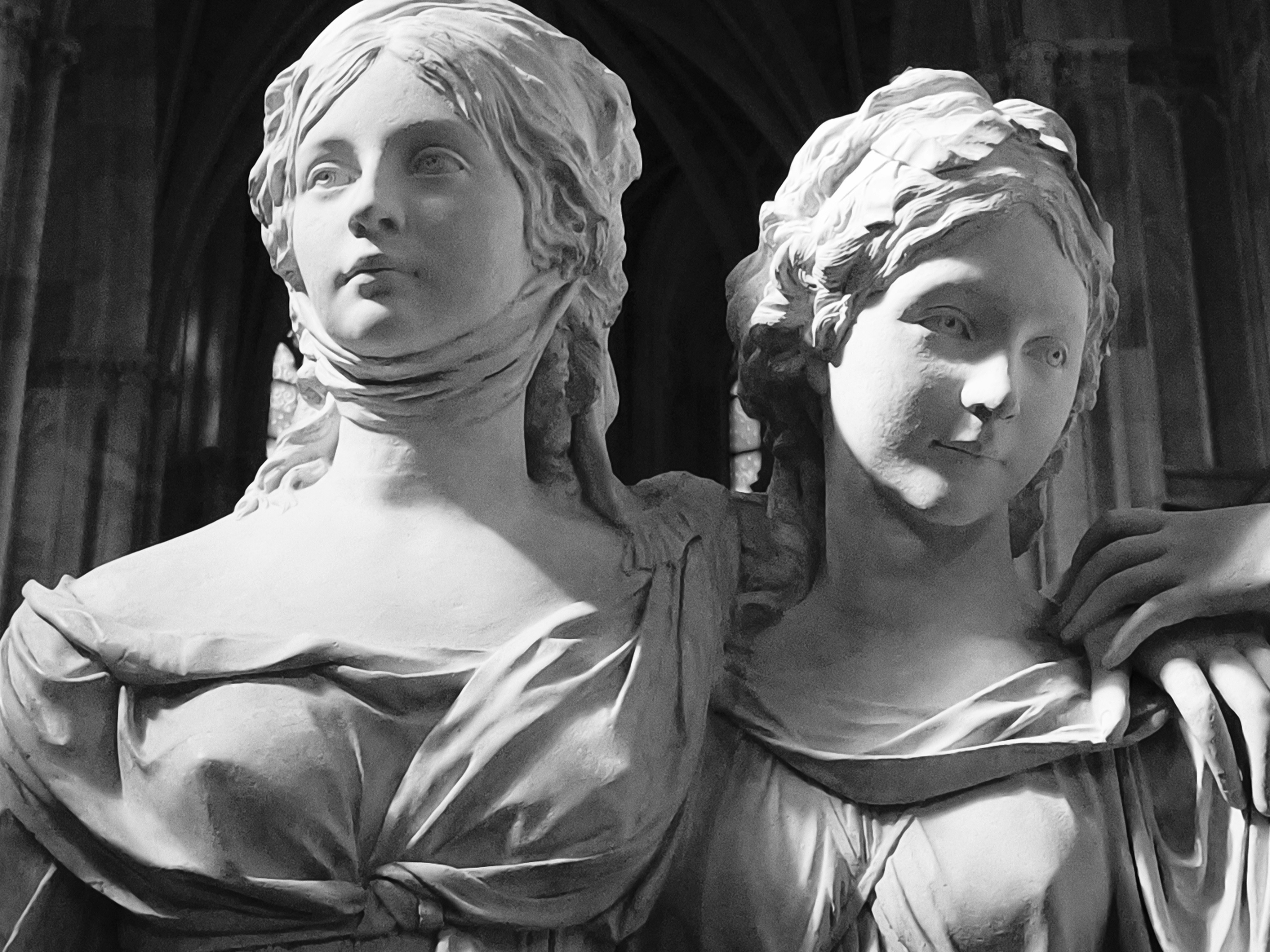 Statues in Shadow: A Quiet Duo of Marble Faces