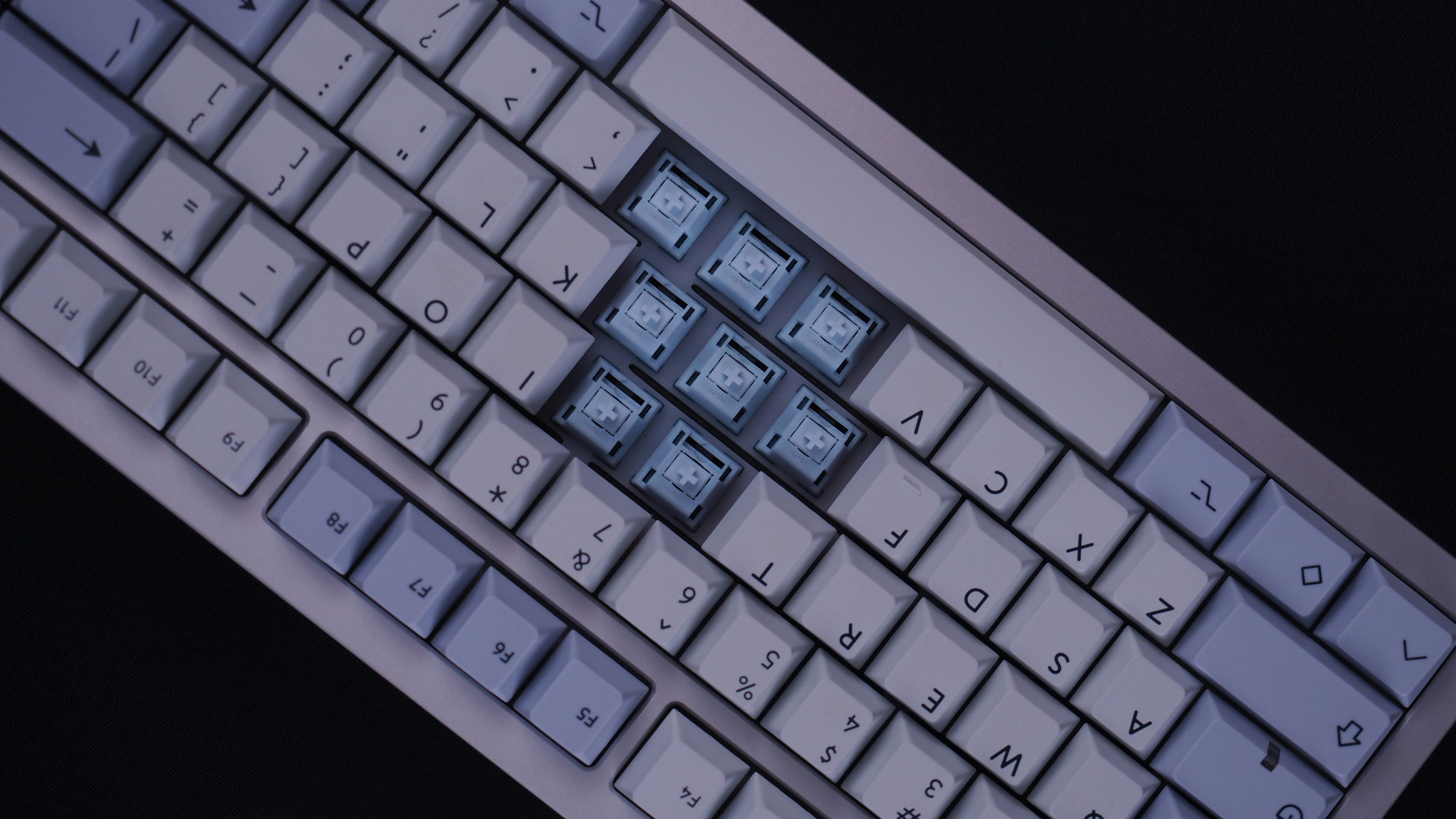 Pastel Keyboard: Fingers Hover Over Silent Keys