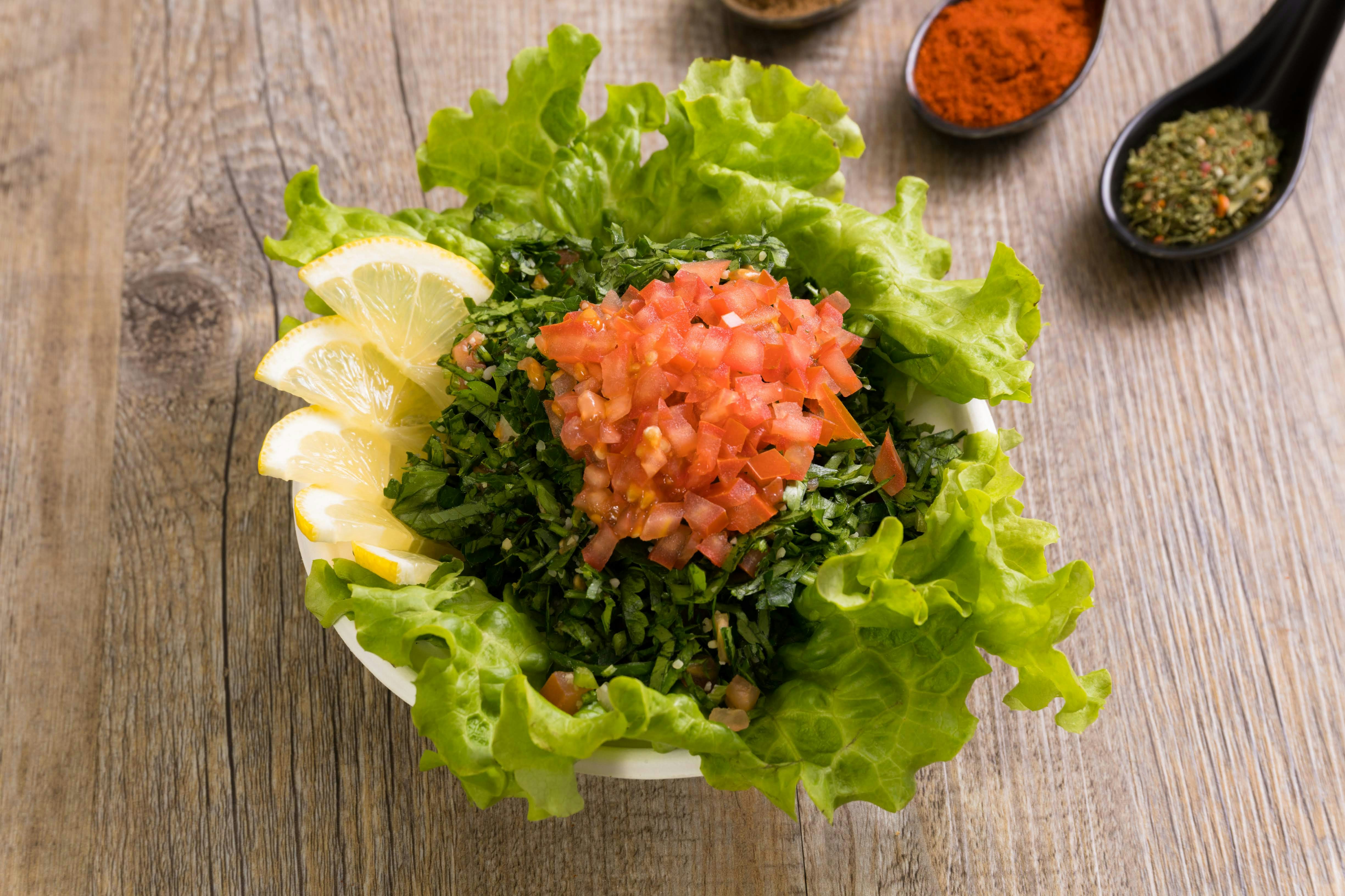 Citrus, Greens, and Tomato Tangle: A Fresh Bowl from Above