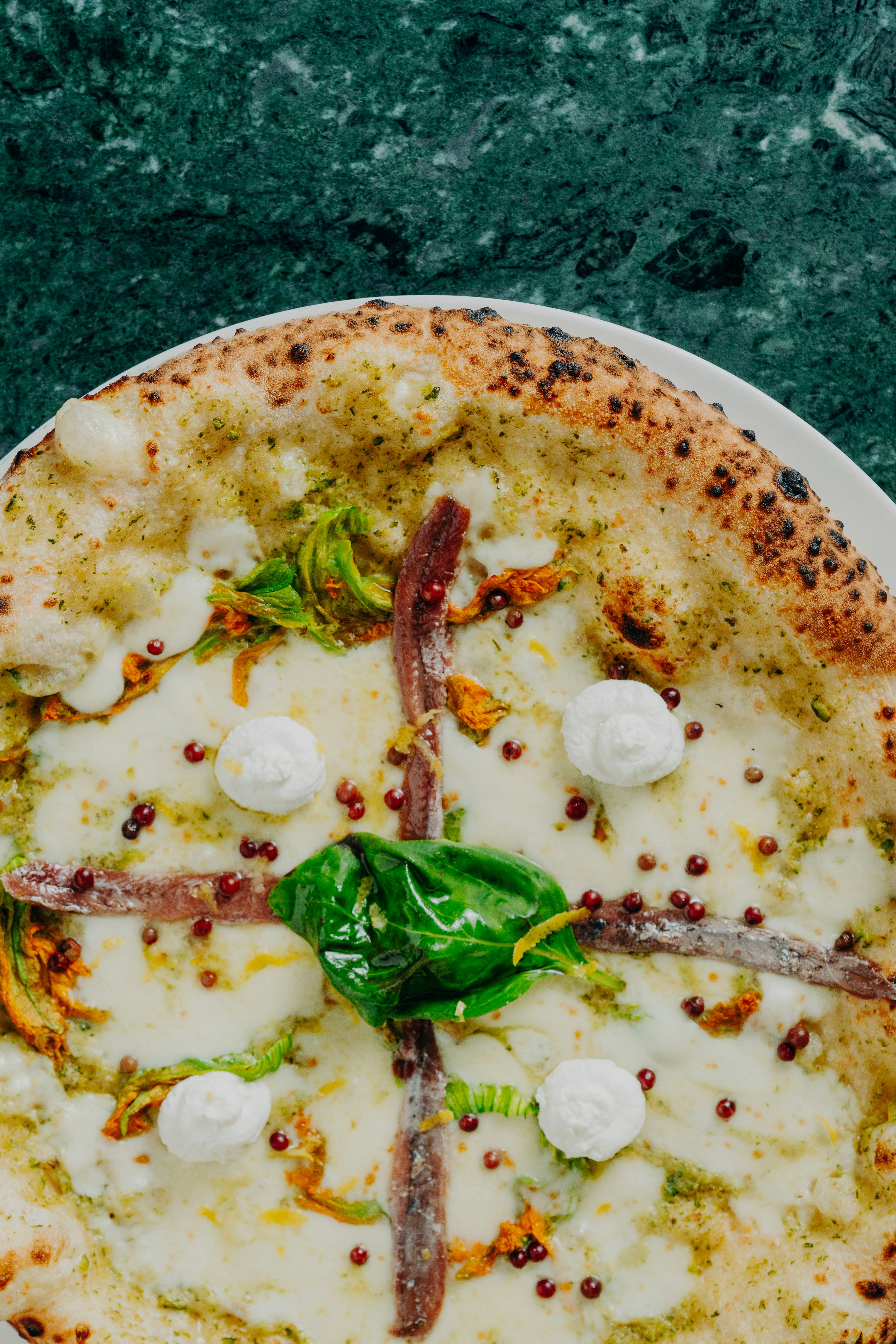 Peppery Herb-Butter Pizza in a Moorish Green Kitchen Scene
