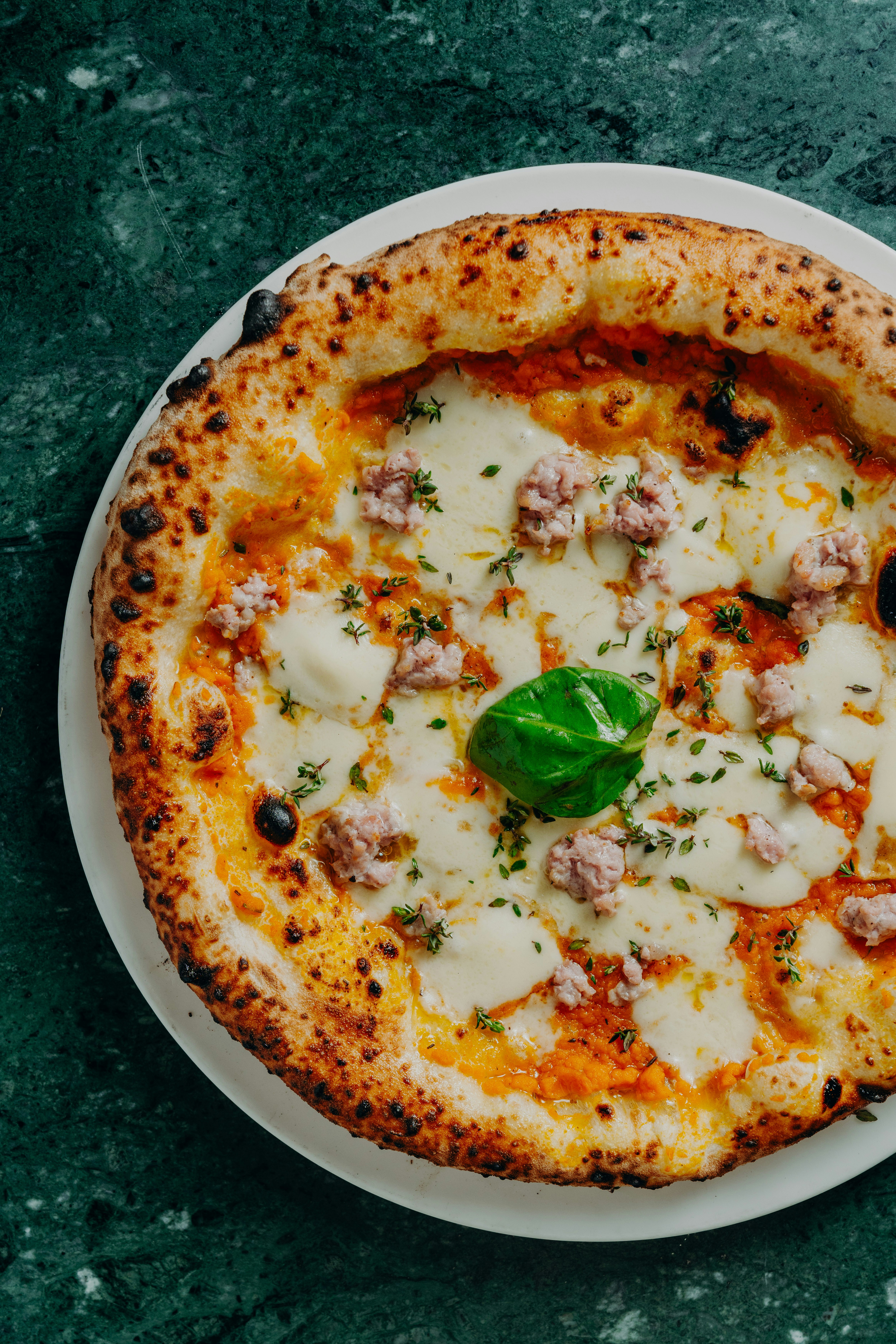 Circular Pizza Portrait: Cheesy Edges and Basil Crown