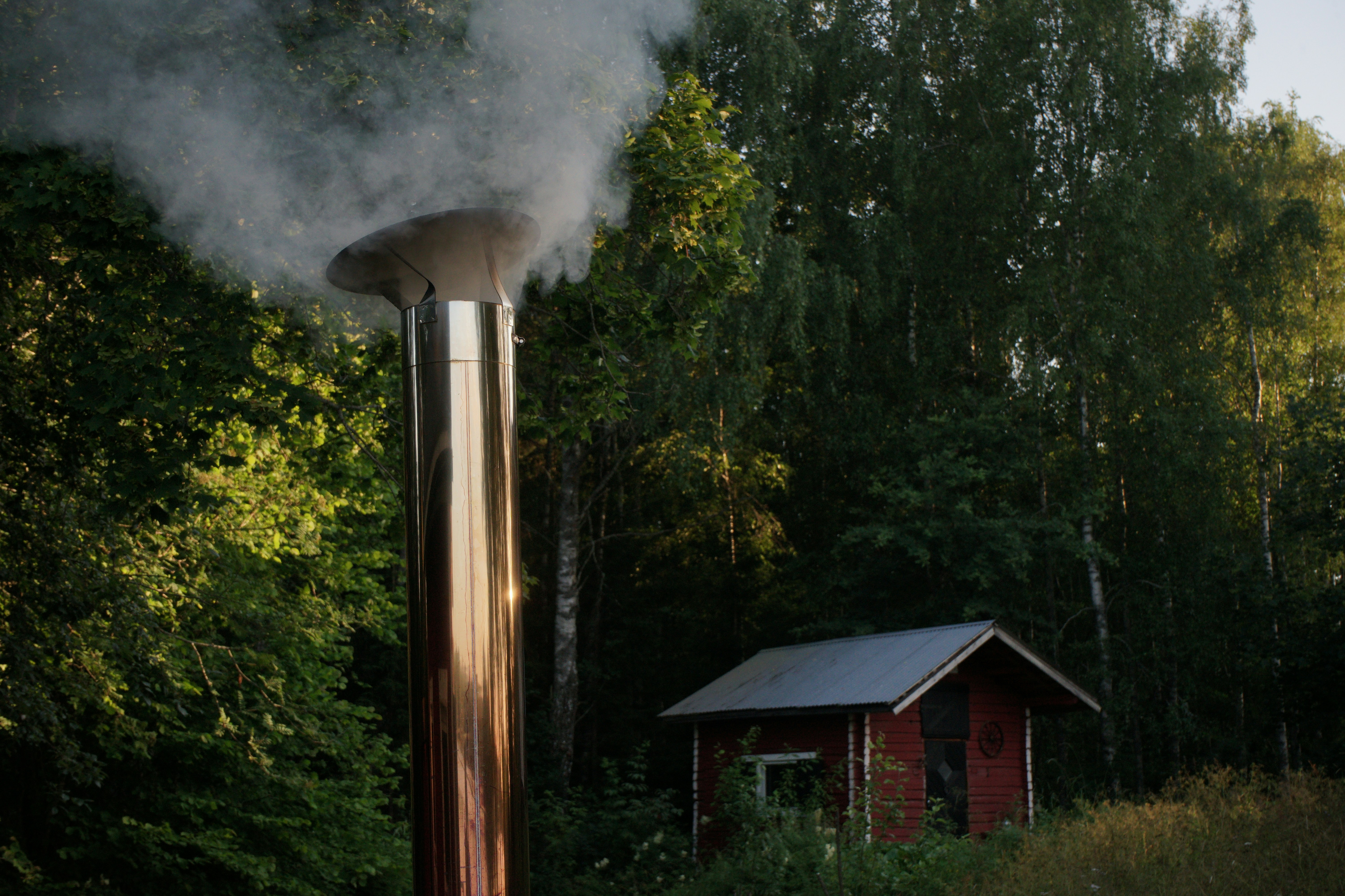 Steam Over Steel: Morning Smoke from a Mountain Chimney