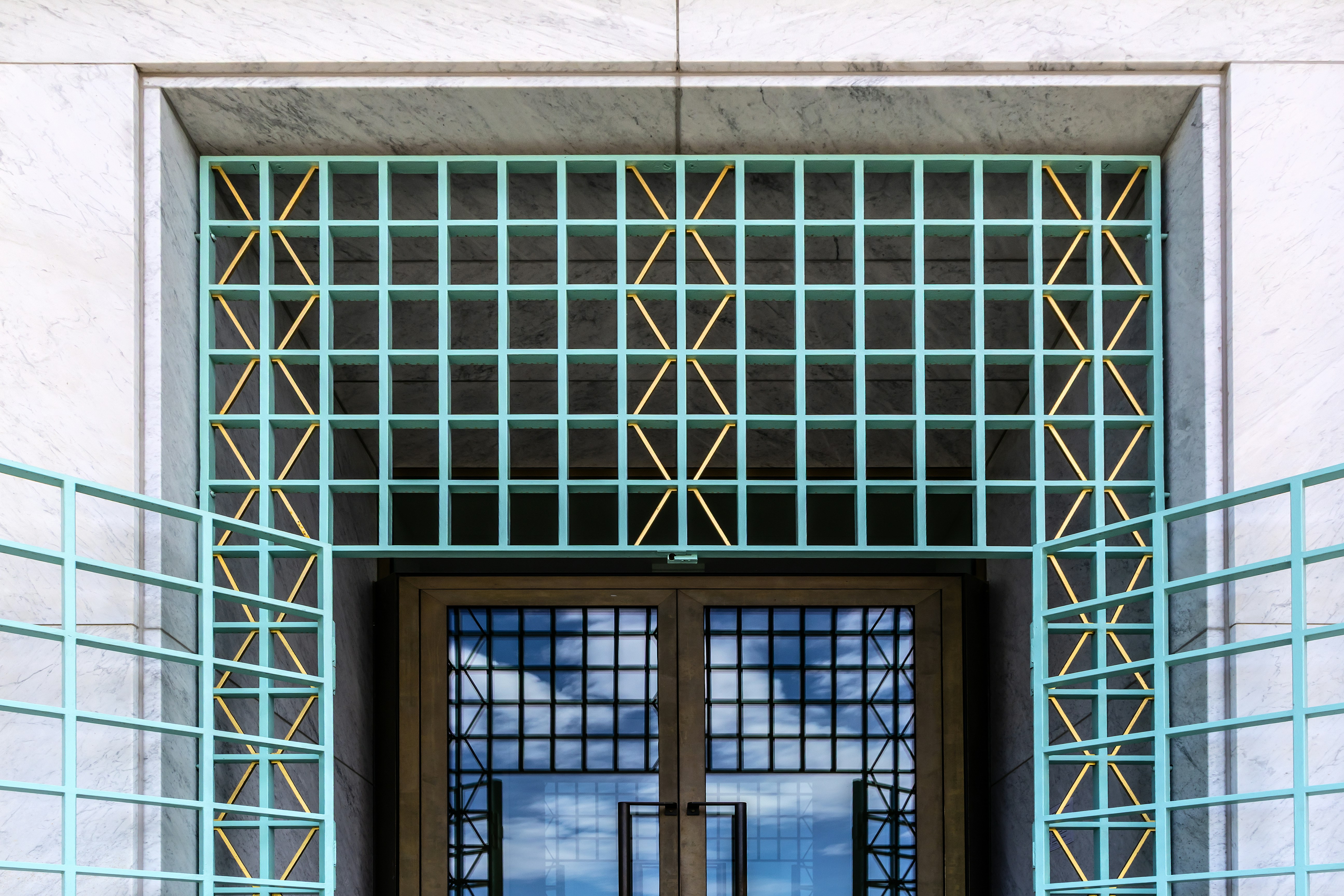 Geometric Doorway: A Grid of Light and Shadow