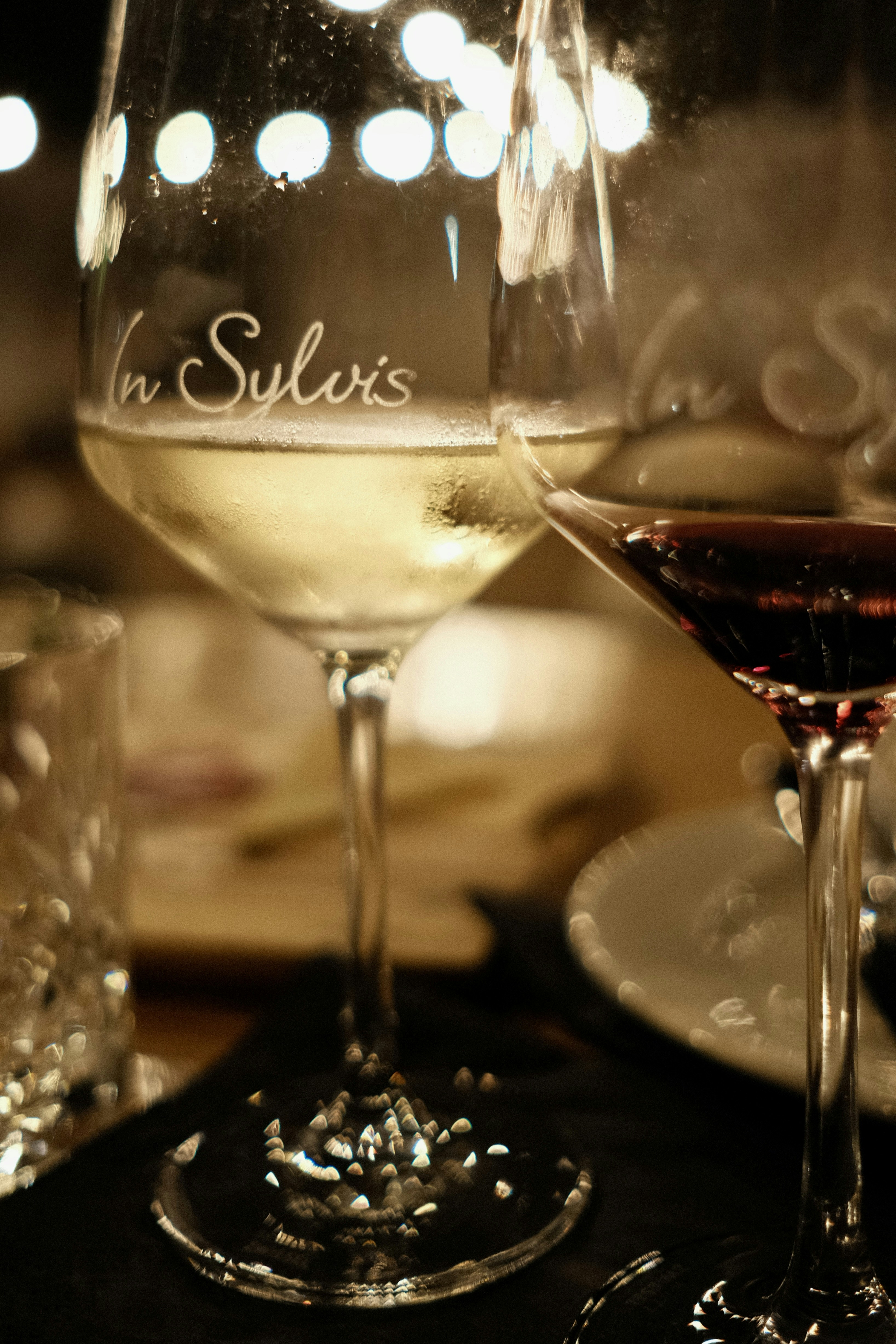 Glassware in Focus: Soft Glow over a Wine-Drenched Table
