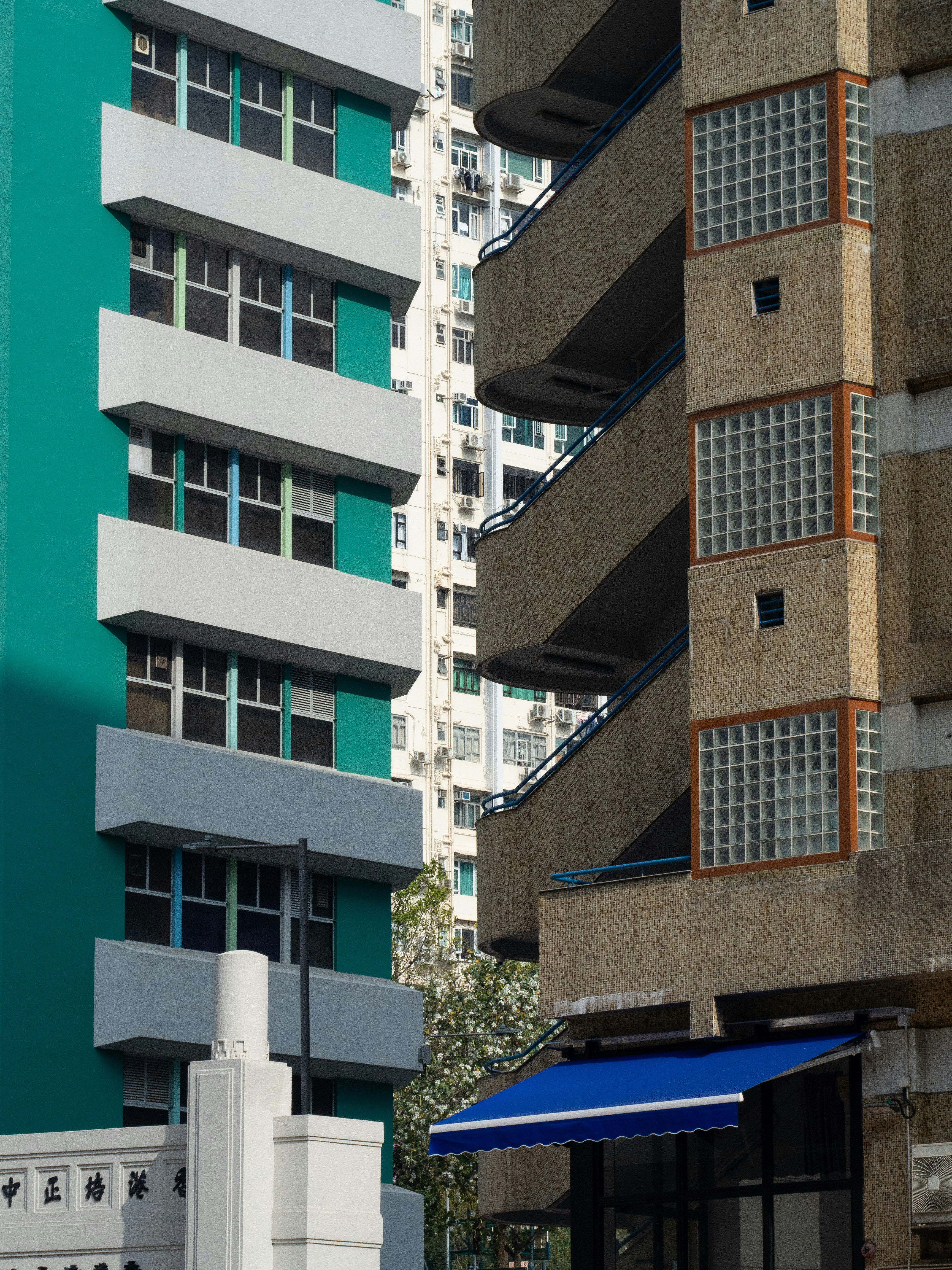 Vertical City Tiers: A Portrait of Modern Architecture and Shadowed Balconies