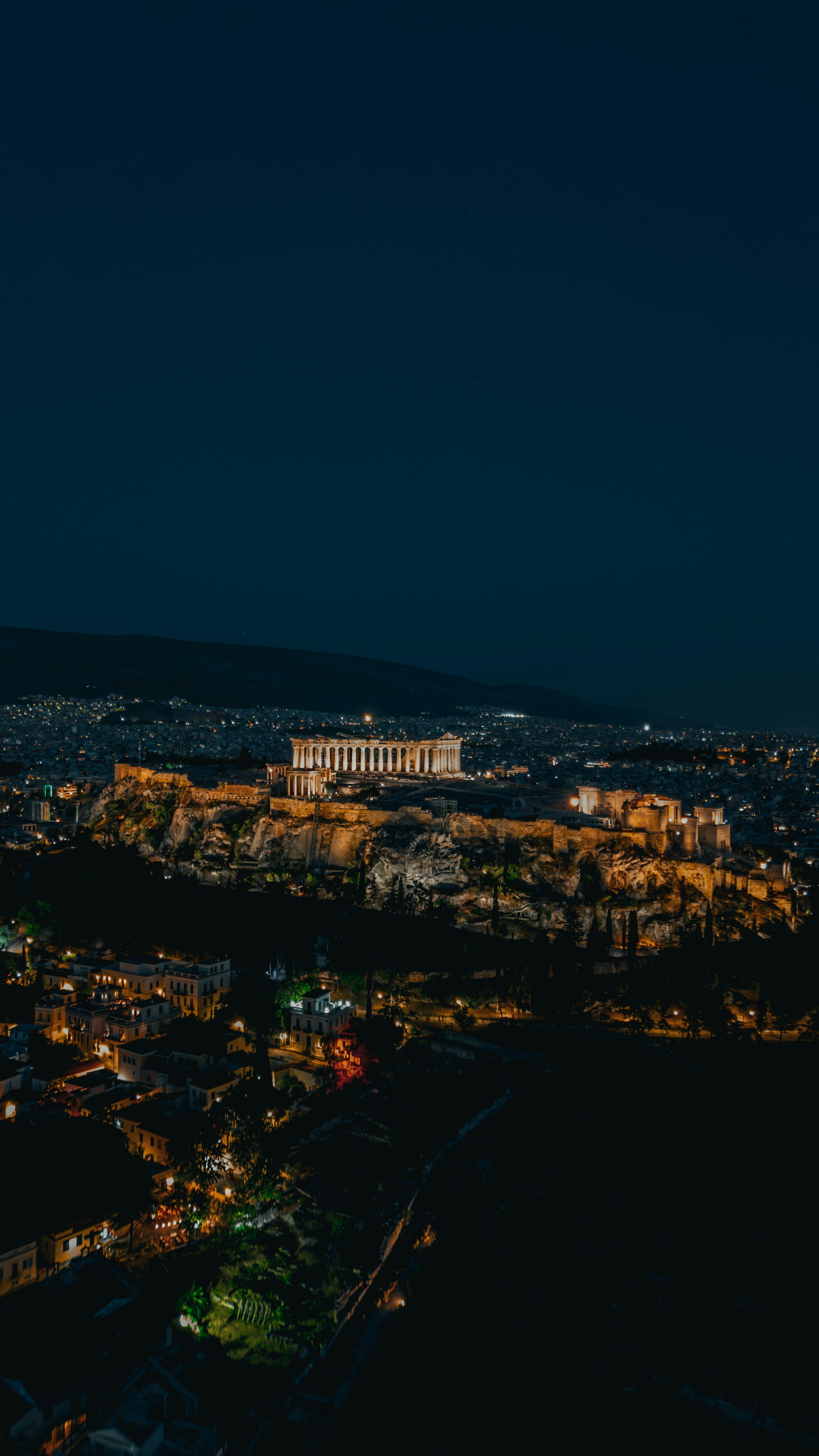 Nightfall Over the Acropolis: City Lights Embrace an Ancient silhouette