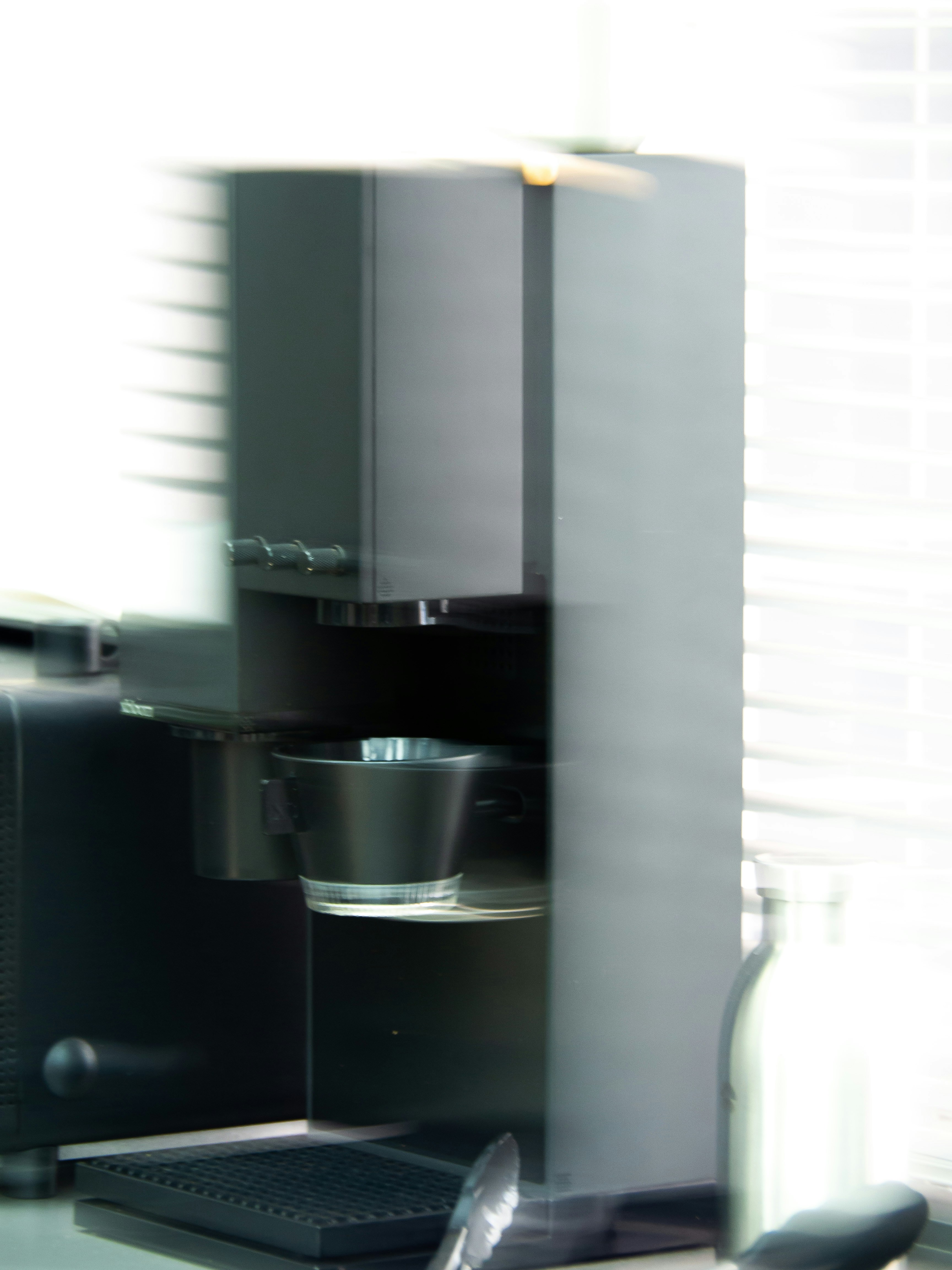 A Quiet Barista Corner: Espresso Machine and Cup in Soft Focus