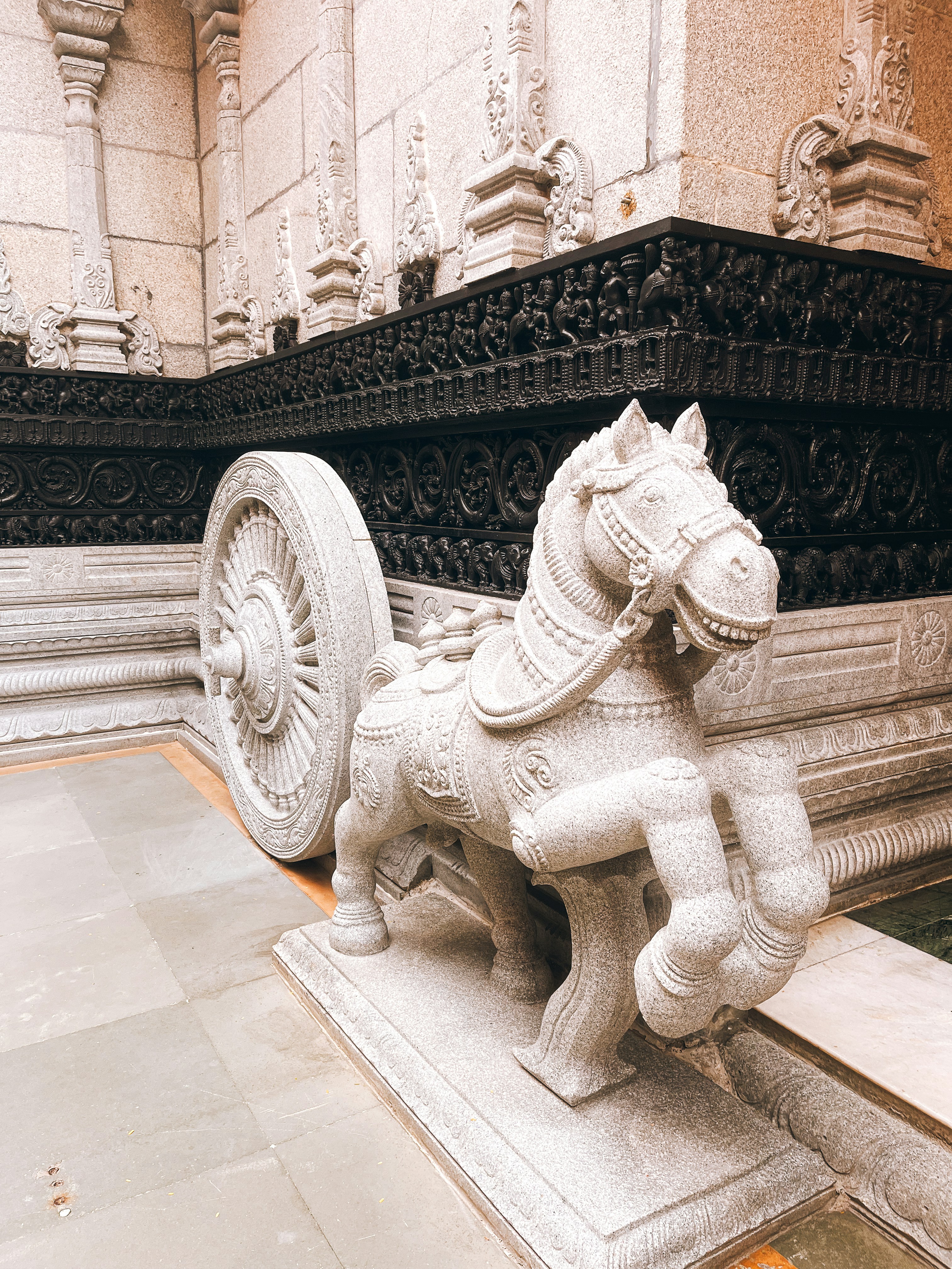 Relic Warrior: A Stone Cavalry Carriage Guard at Carved Temple Wall