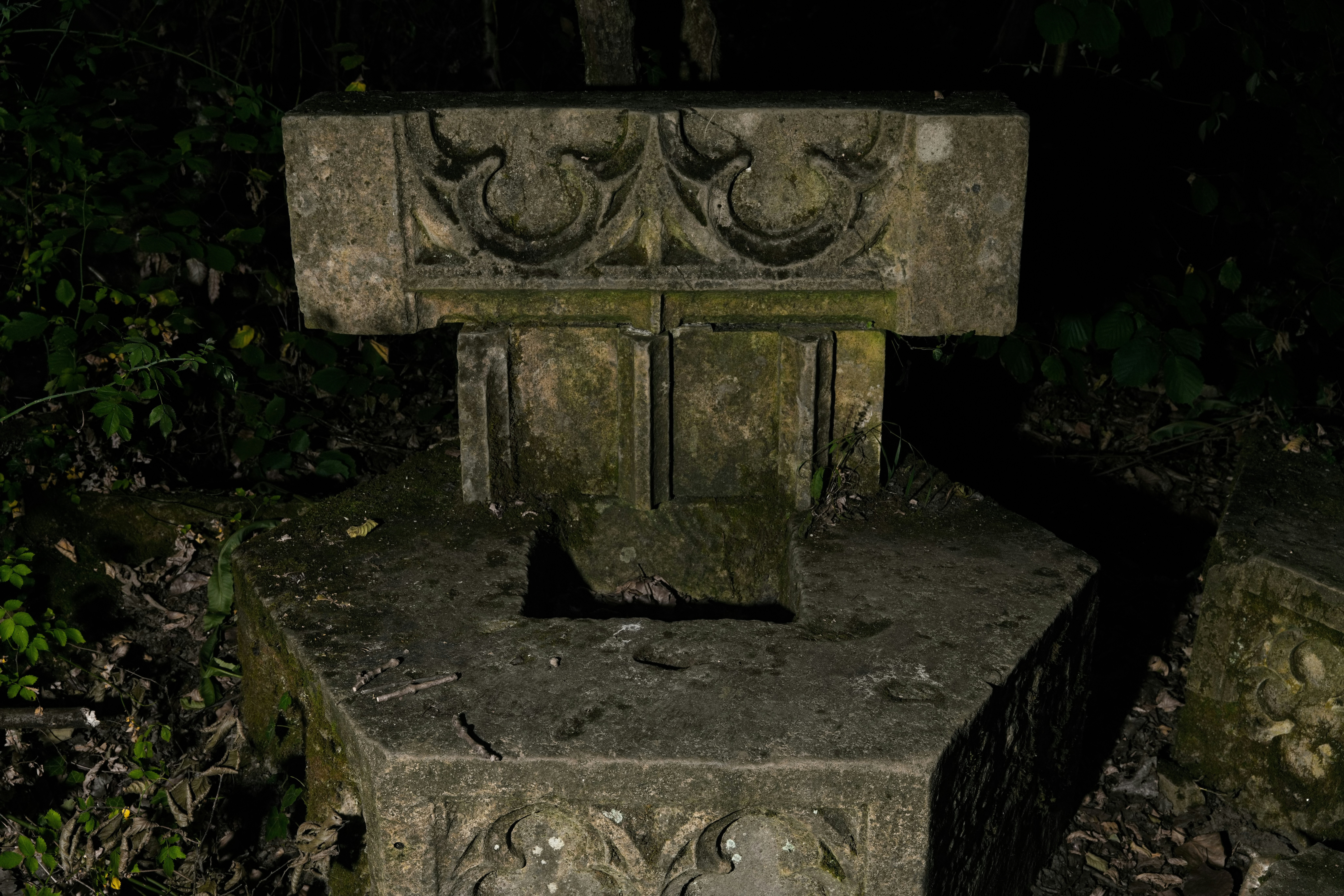 Ancient Stone Pedestal in Moonlit Garden