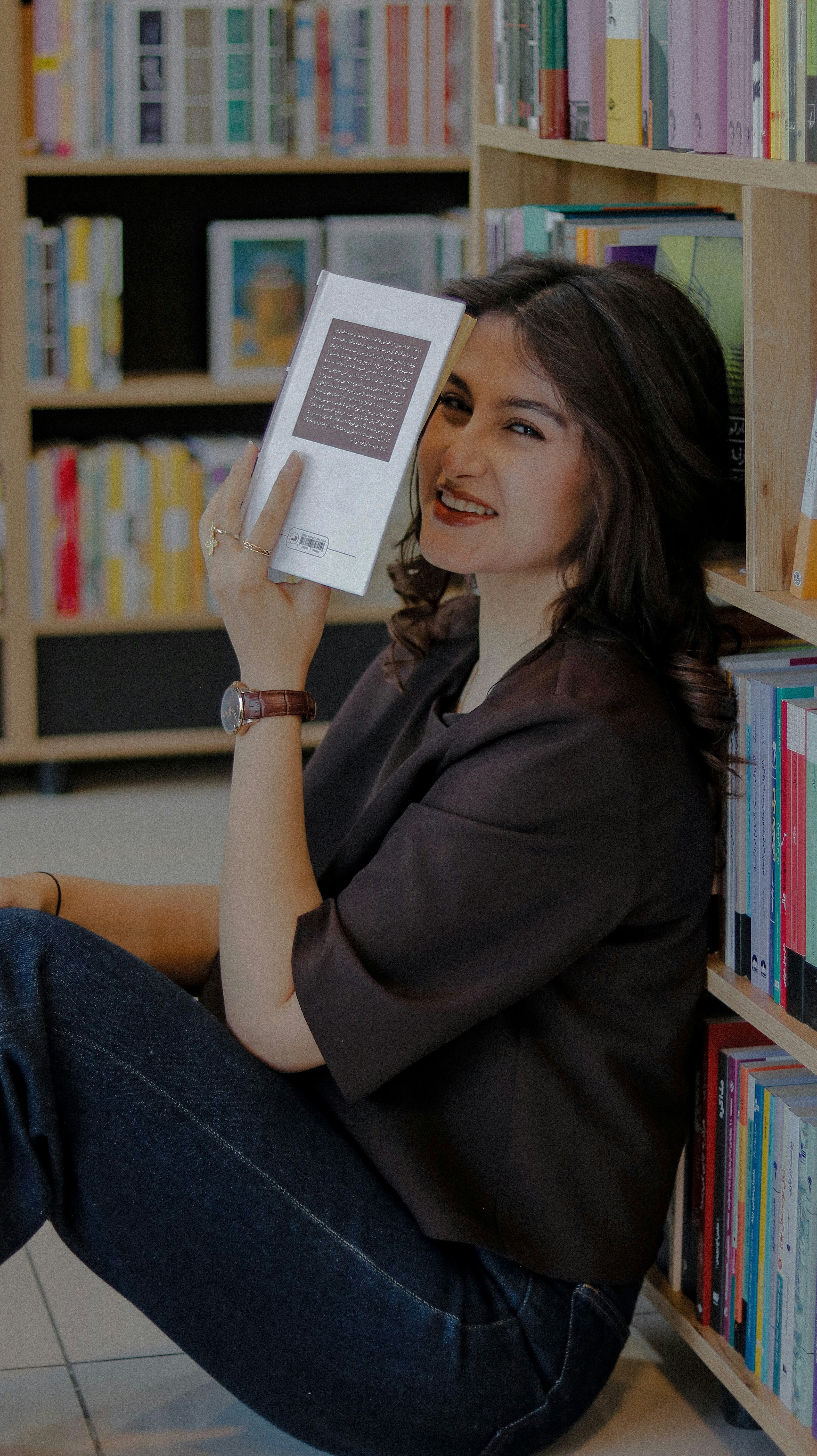 Shelf-side Smile: A Quiet Moment with a Booklover