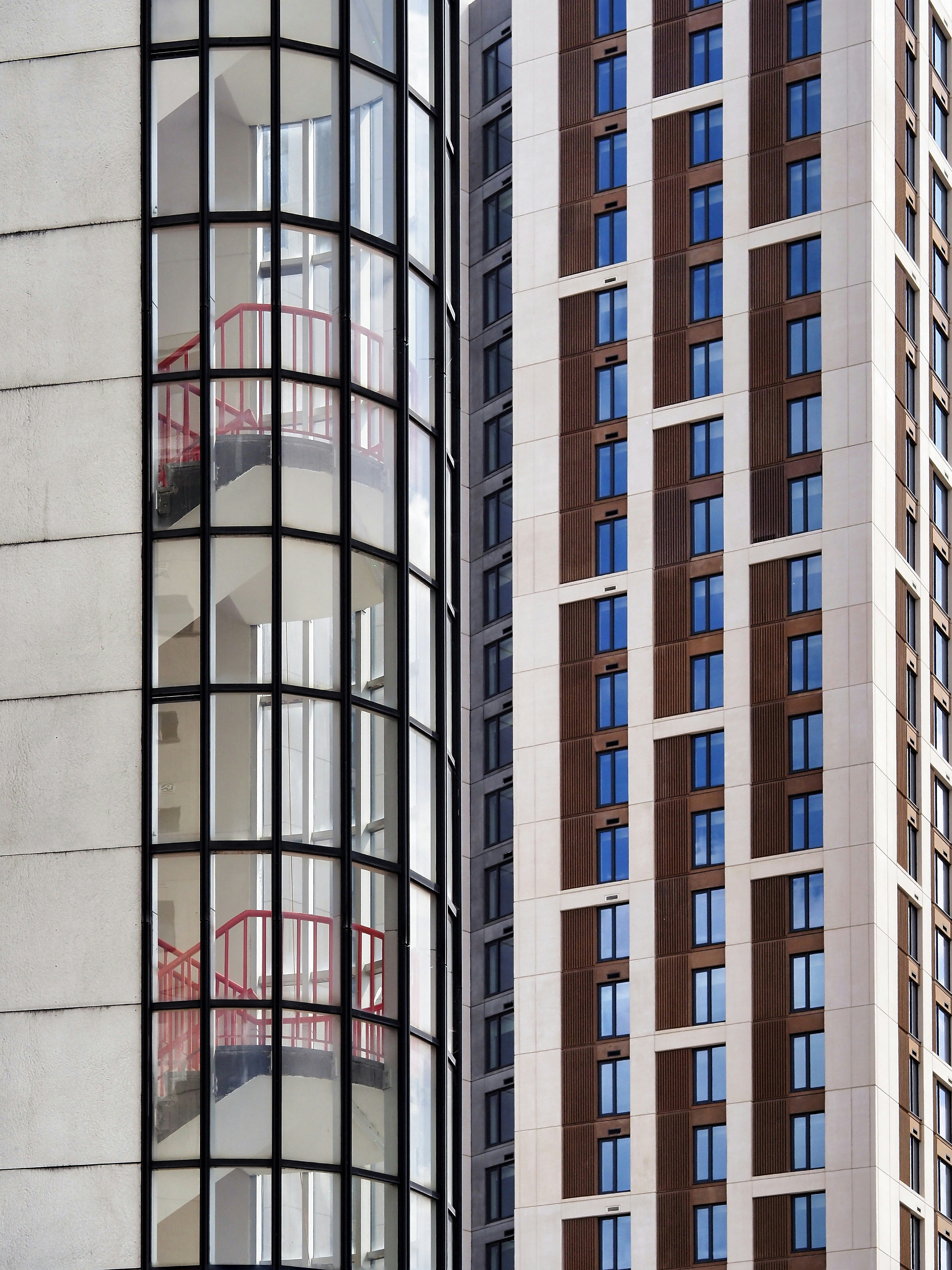 Urban Facades: Glass Curves and Brick Grid
