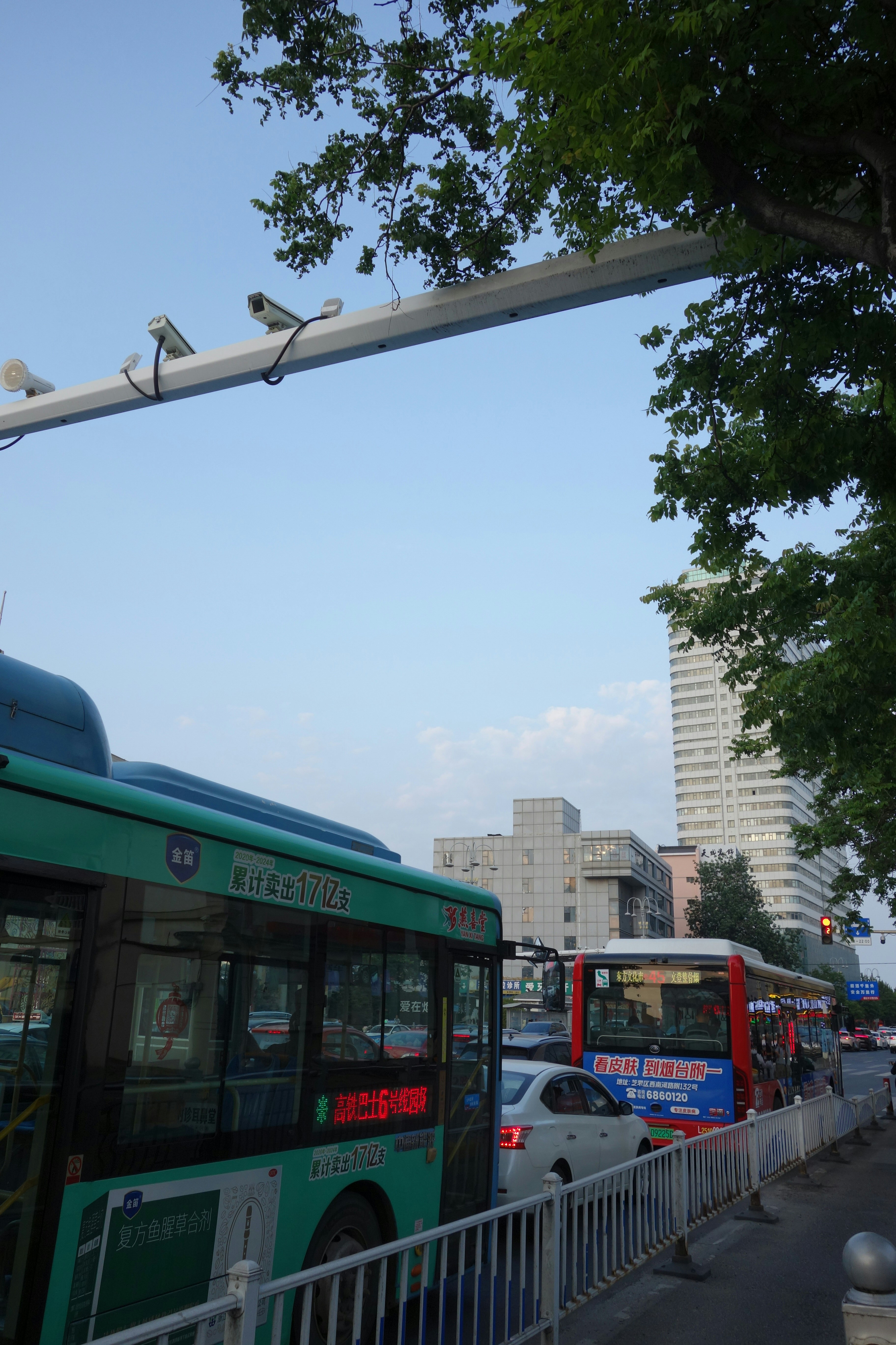 City Bus Arcade: A Snapshot of Urban Transit Under a Blue Sky