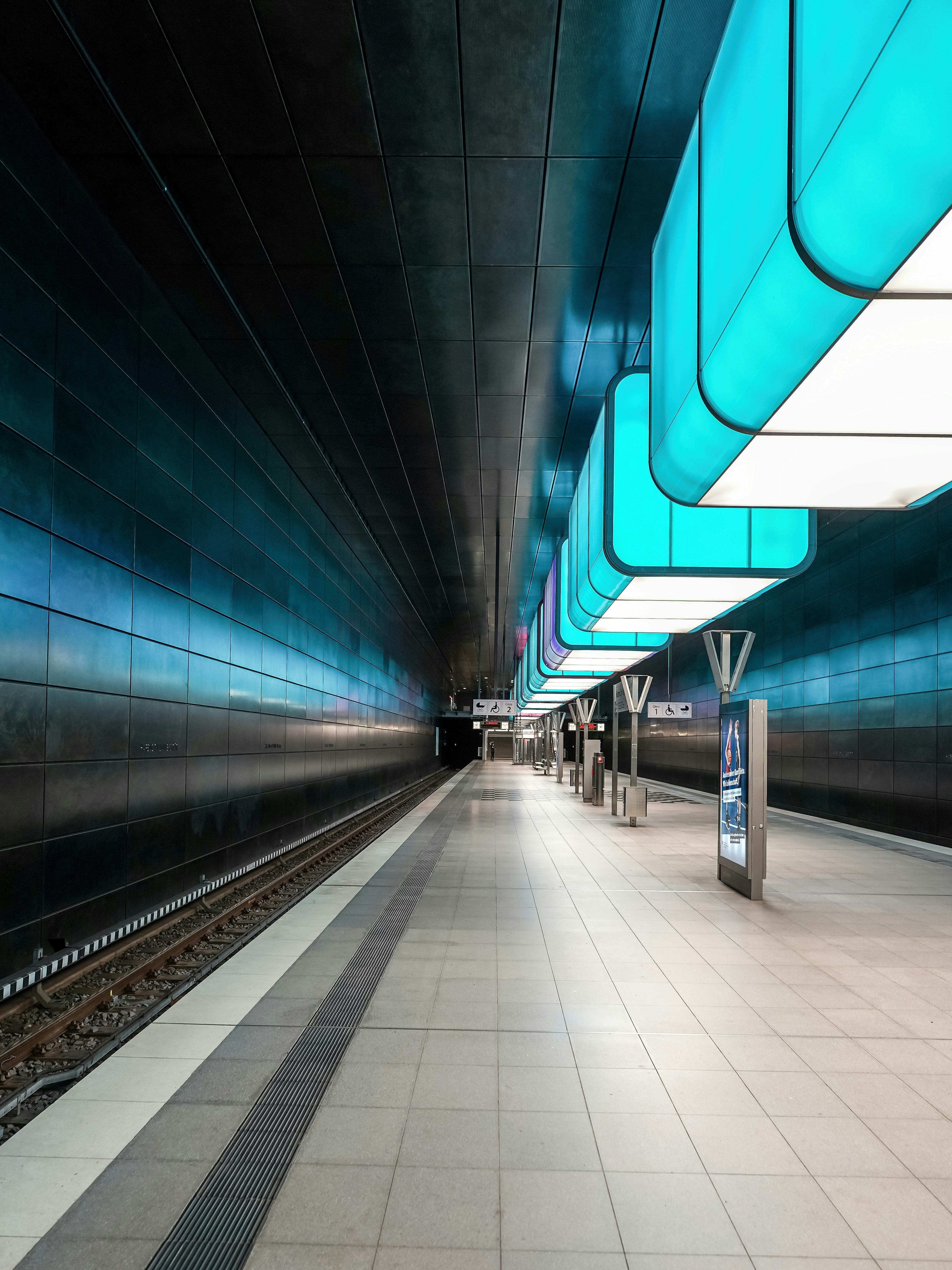 Neon Canopy over Quiet Rails: A Minimalist Metro Corridor