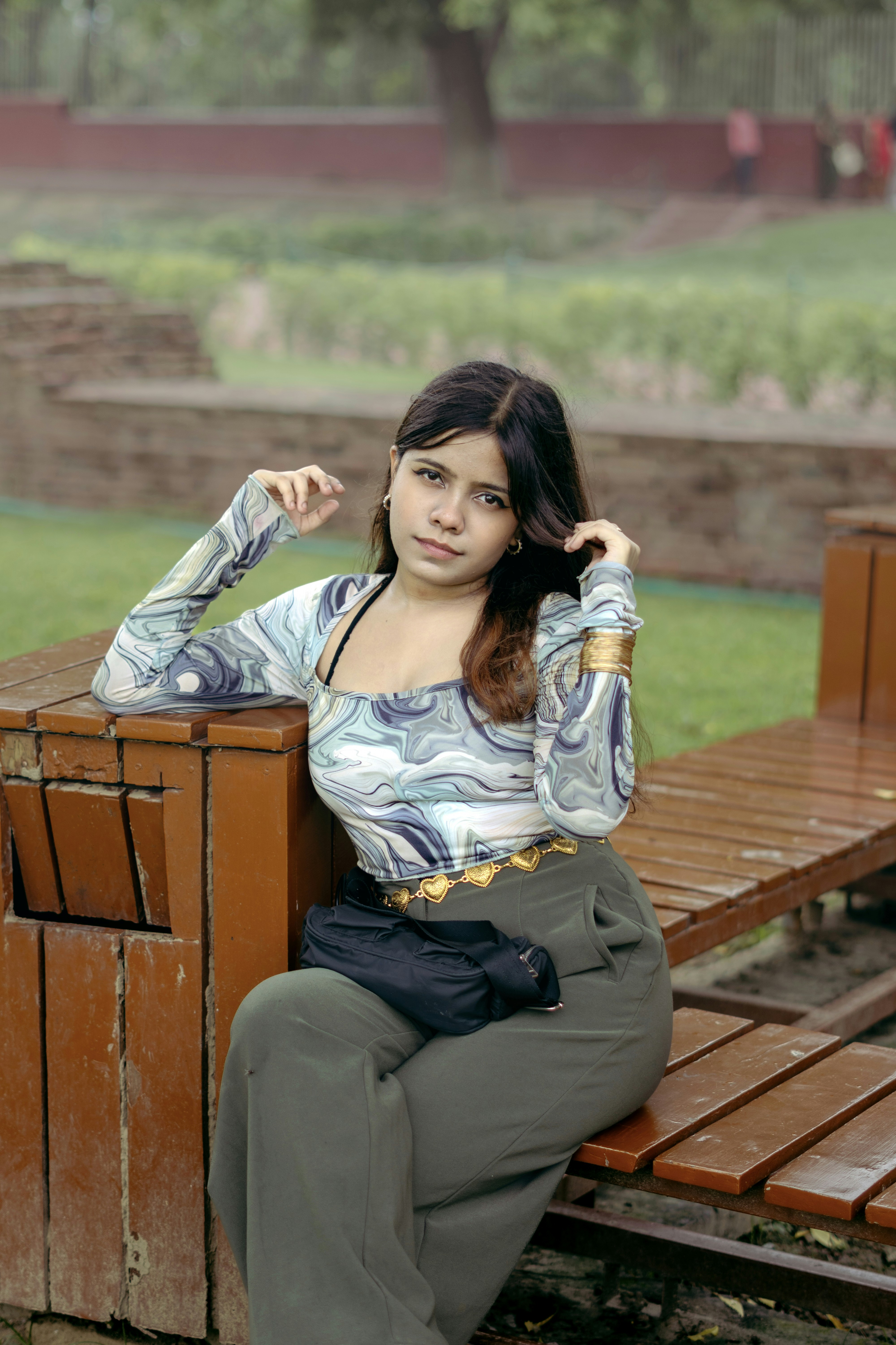 Portrait on a Wooden Bench: Subtle Confidence in the Park